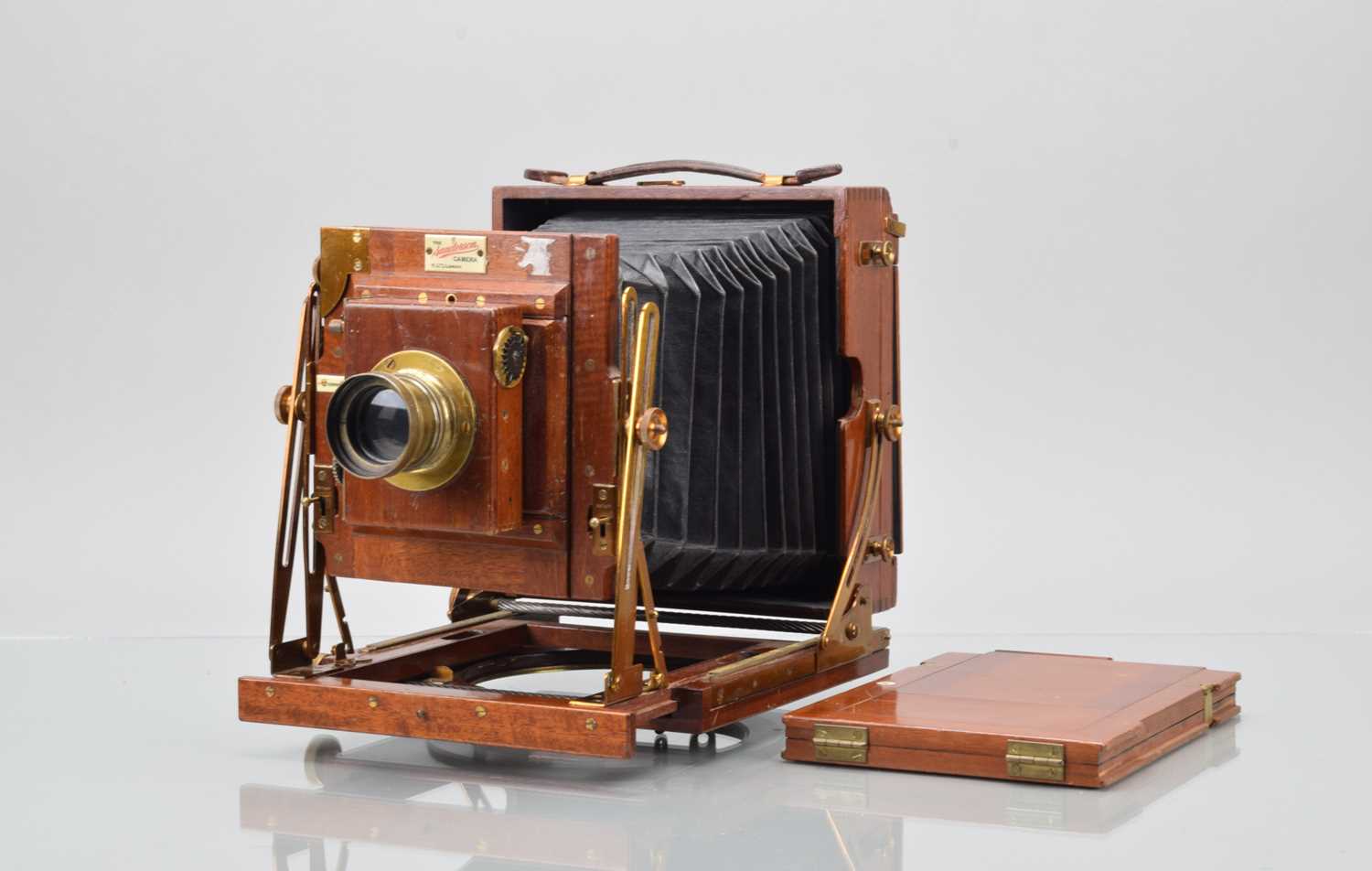 A Sanderson Half Plate Mahogany and Brass Field Camera, body G, some ...