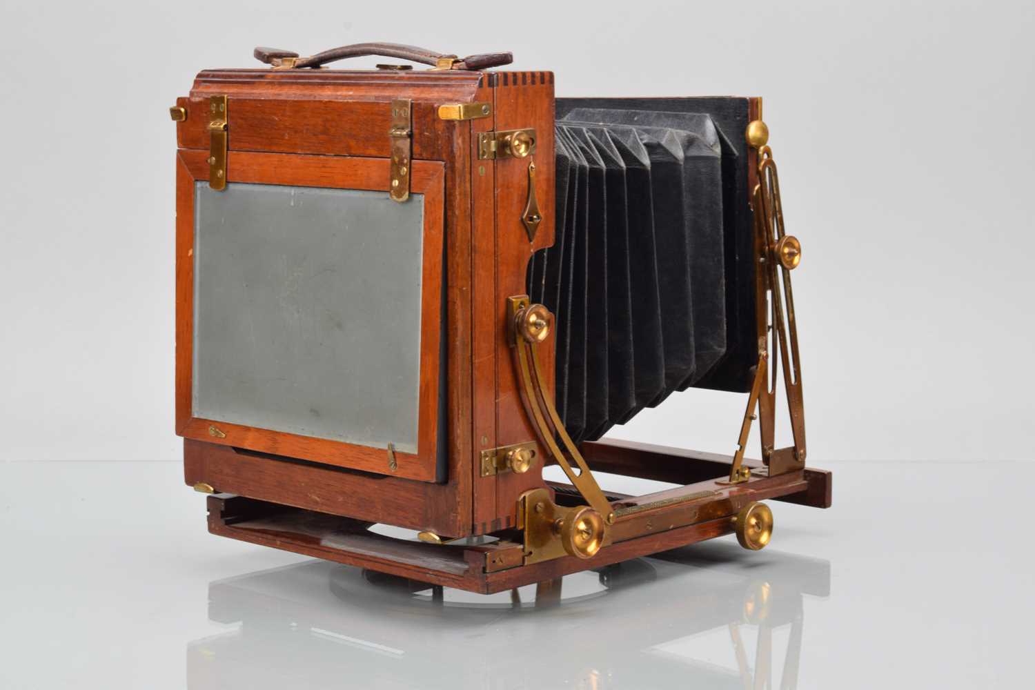 A Sanderson Half Plate Mahogany and Brass Field Camera, body G, some ...