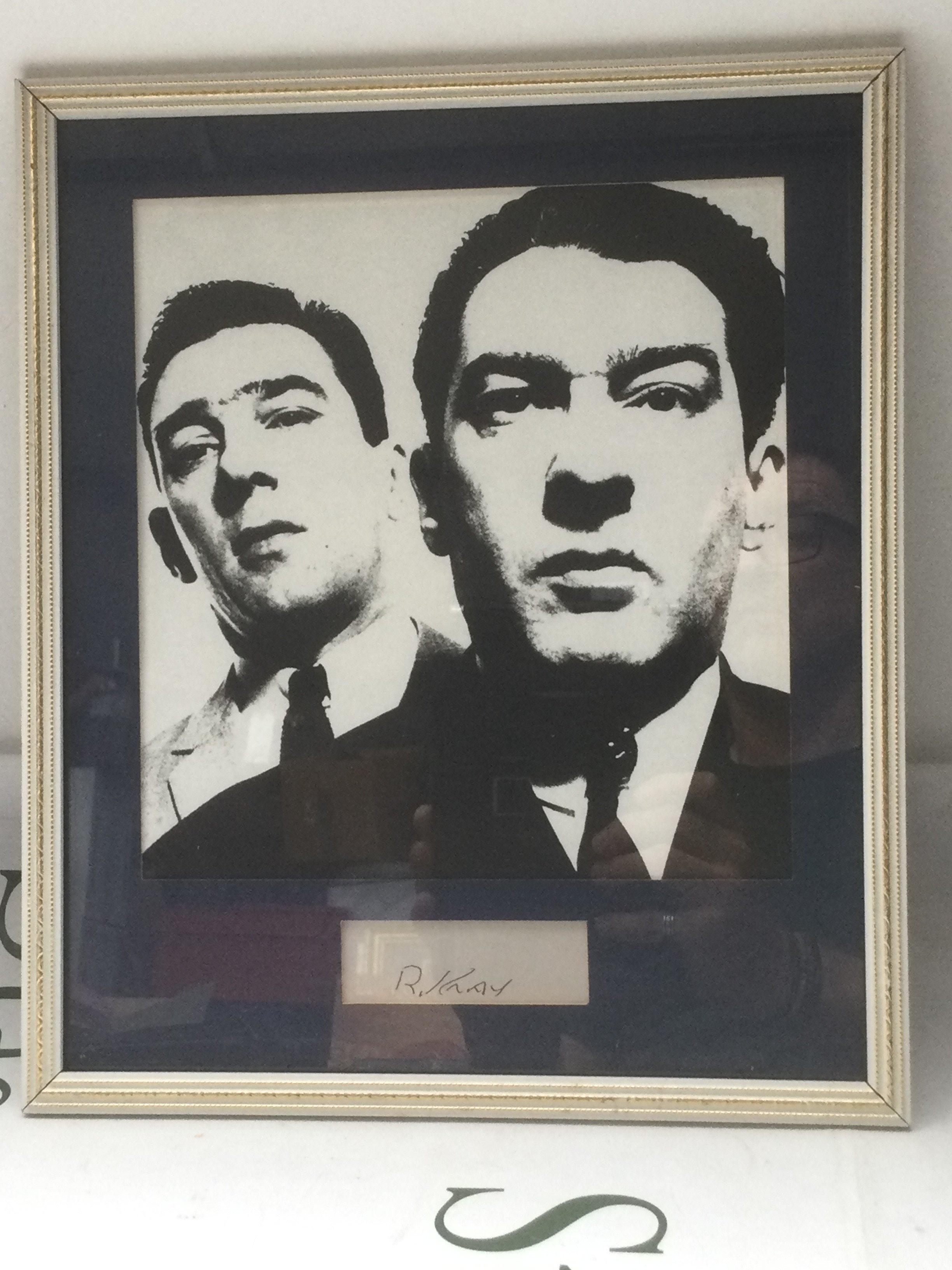 A framed and glazed display of the Kray twins with Reggie Kray's ...