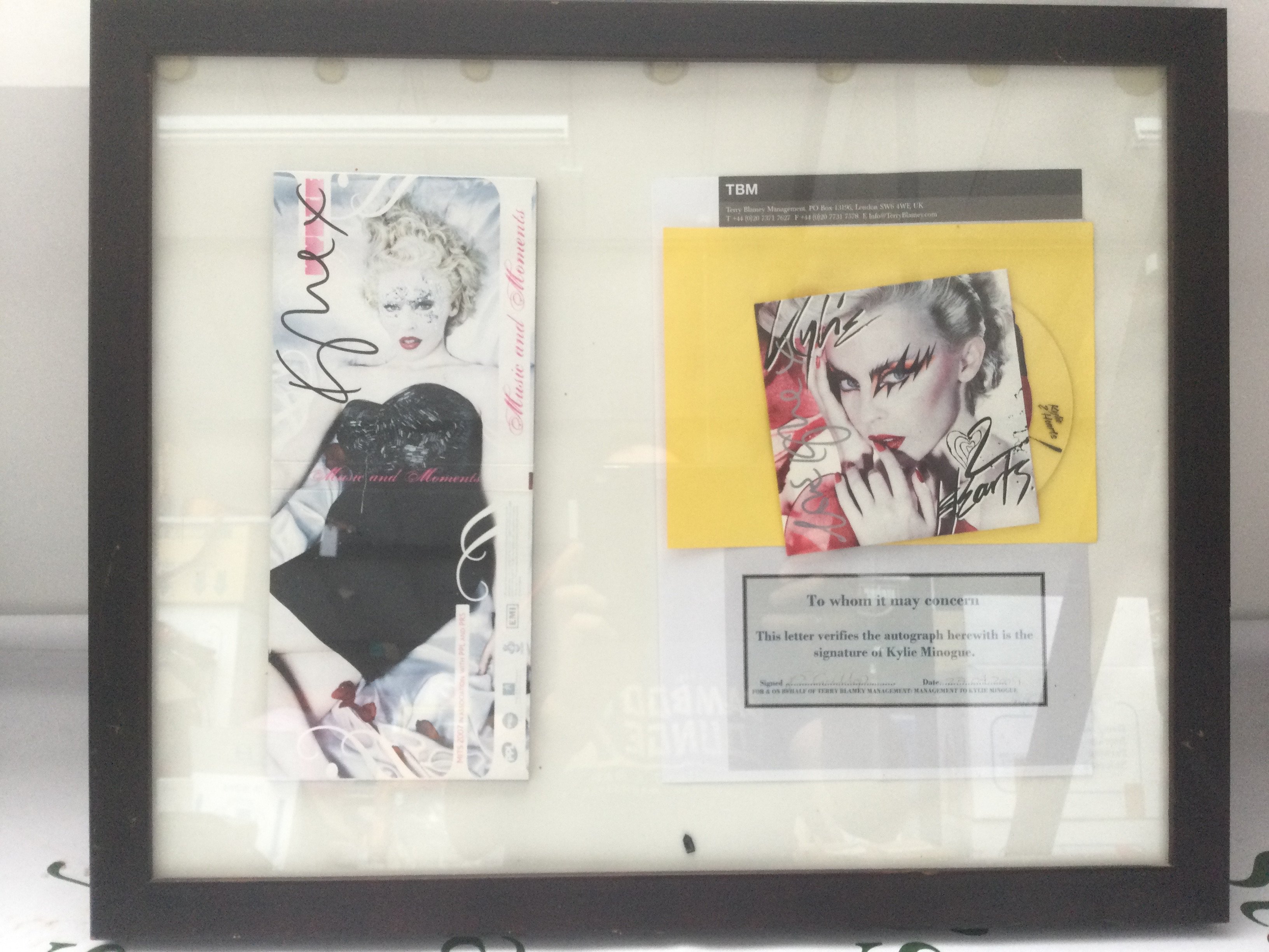 A framed and glazed signed montage of Kylie Minogue with COA, approx ...