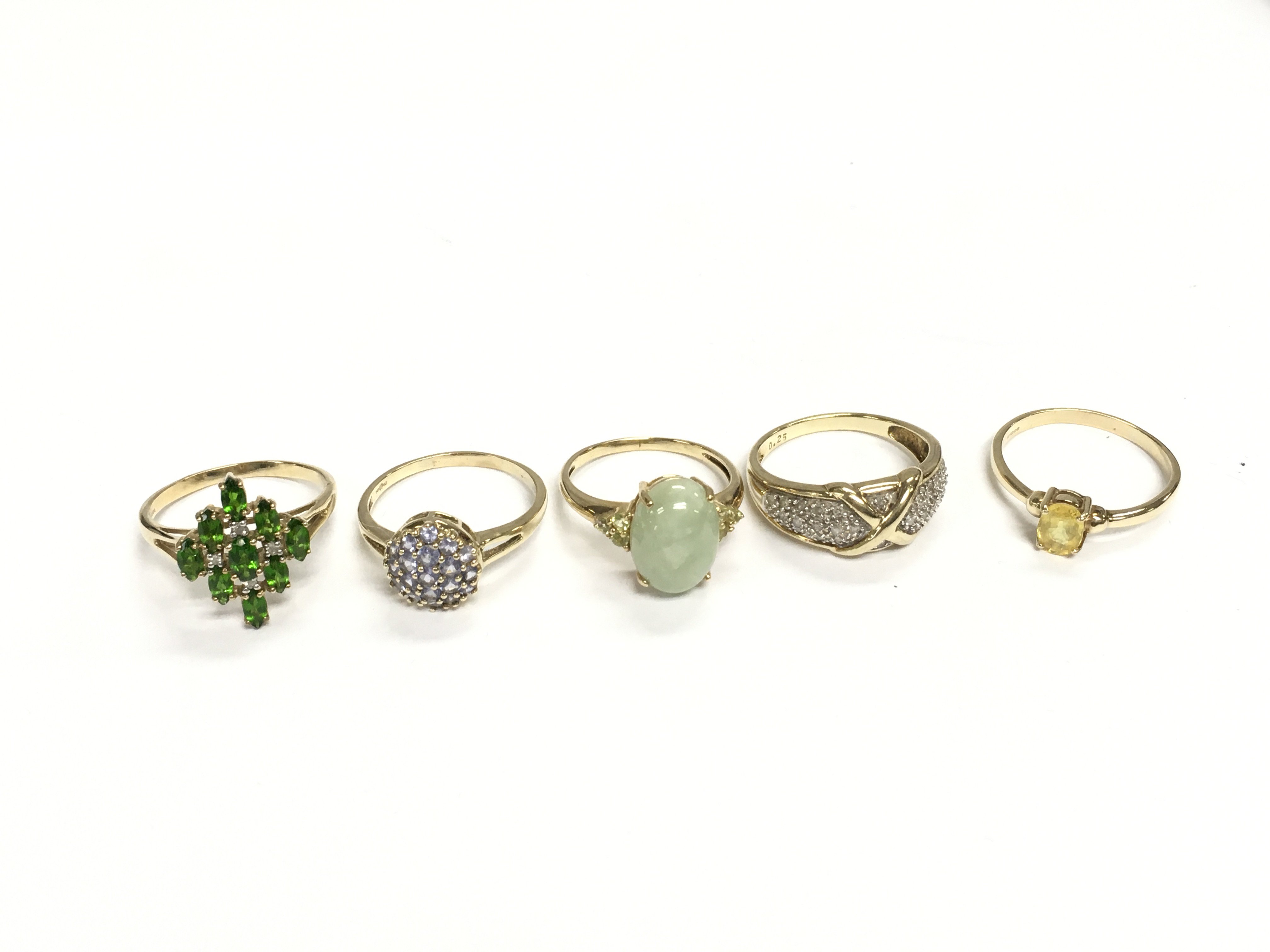 A collection of 5 assorted rings set with various stones. 15.20g