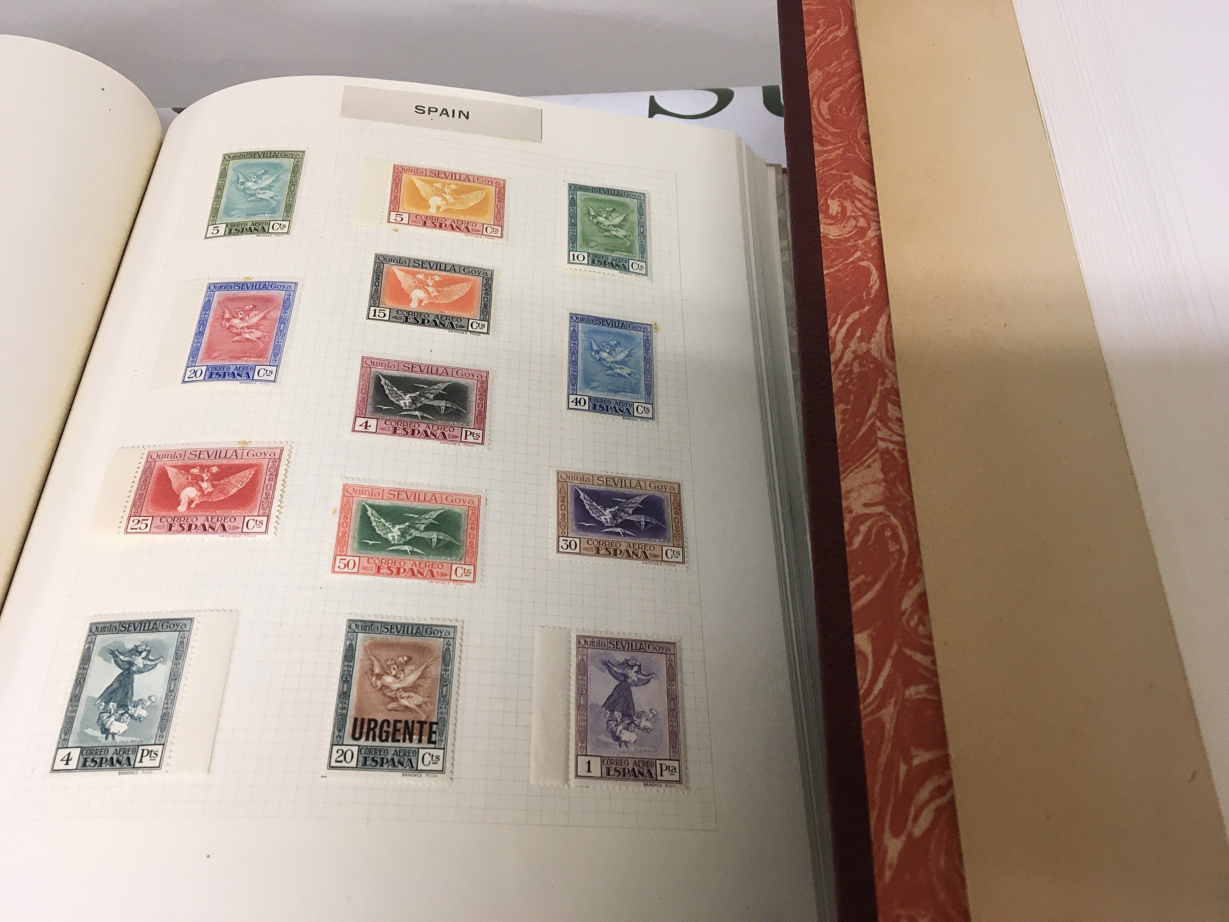 A Box containing Six albums of stamps including American stamps two ...