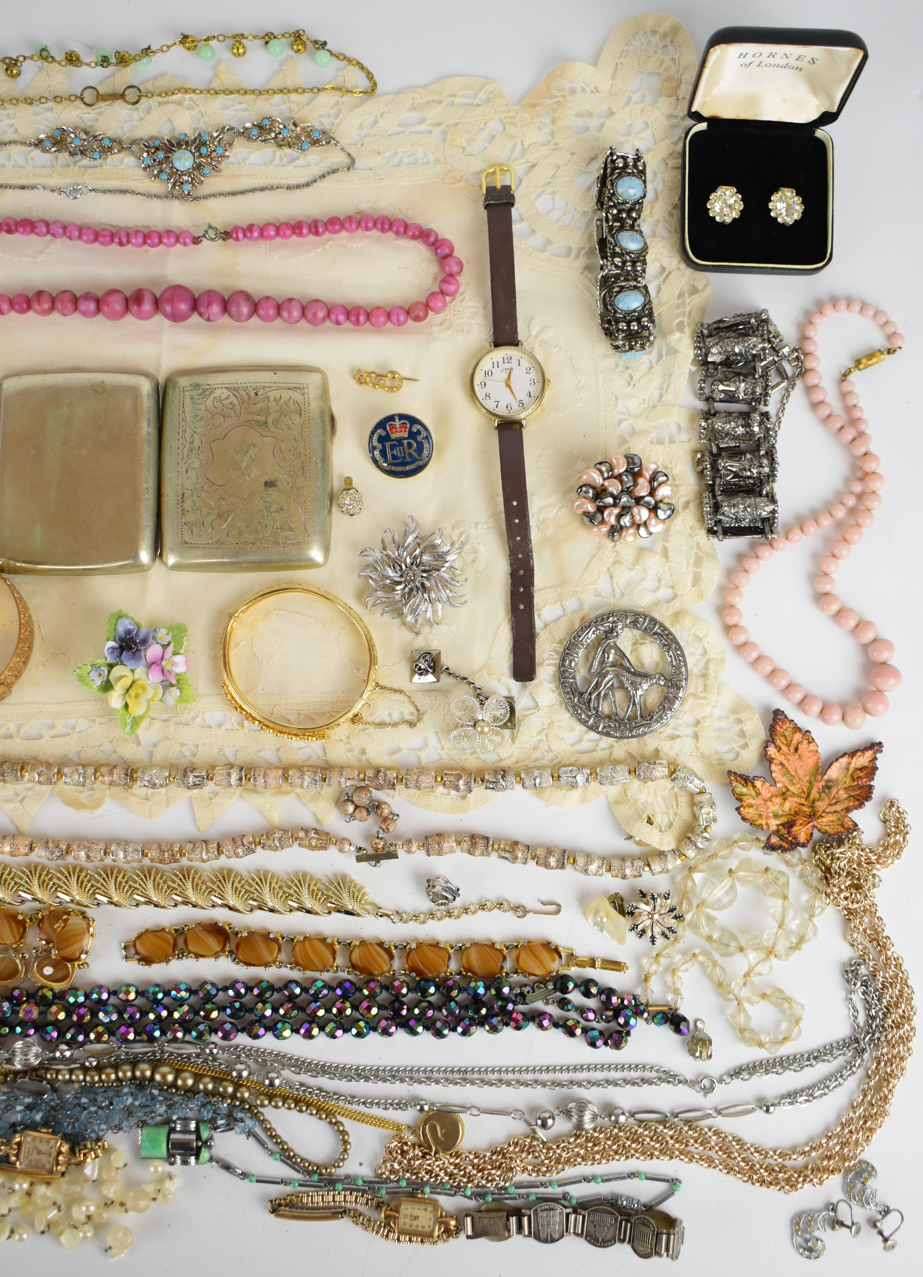 A collection of costume jewellery including vintage necklaces, brooches ...