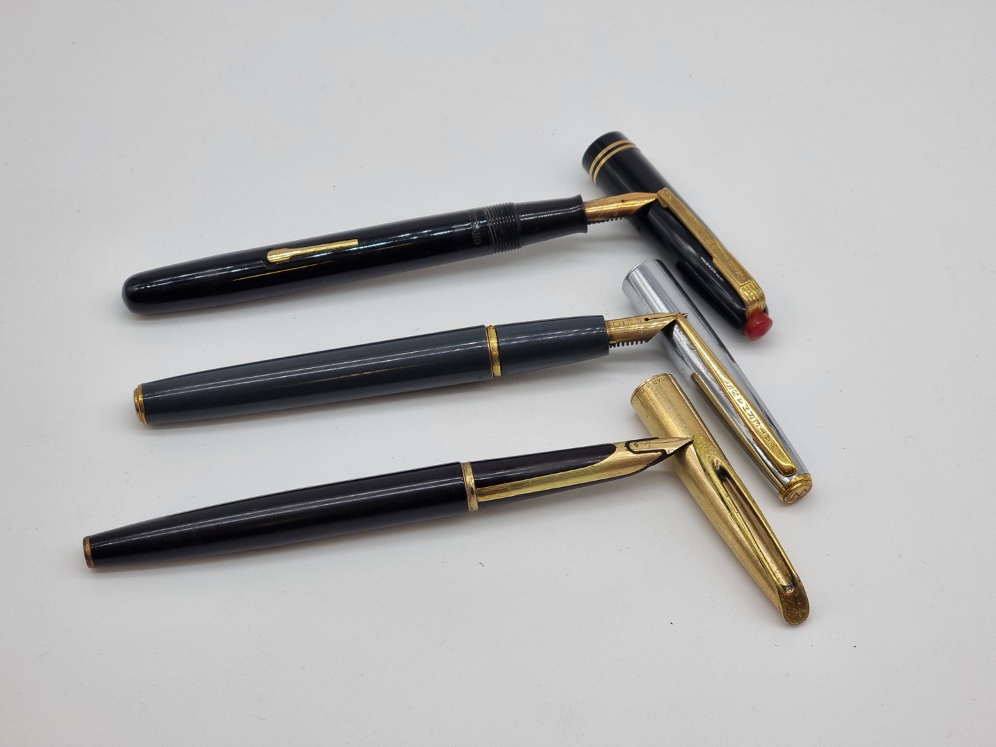 Three vintage Watermans fountain pens, to include a '503', with 14ct ...