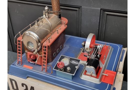 A Wilesco D24 stationary steam engine, 41cm wide, boxed; together with ...