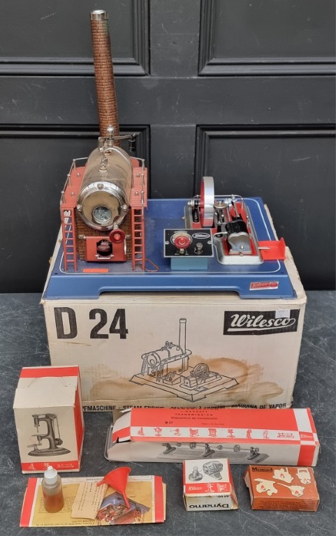 A Wilesco D24 stationary steam engine, 41cm wide, boxed; together with ...