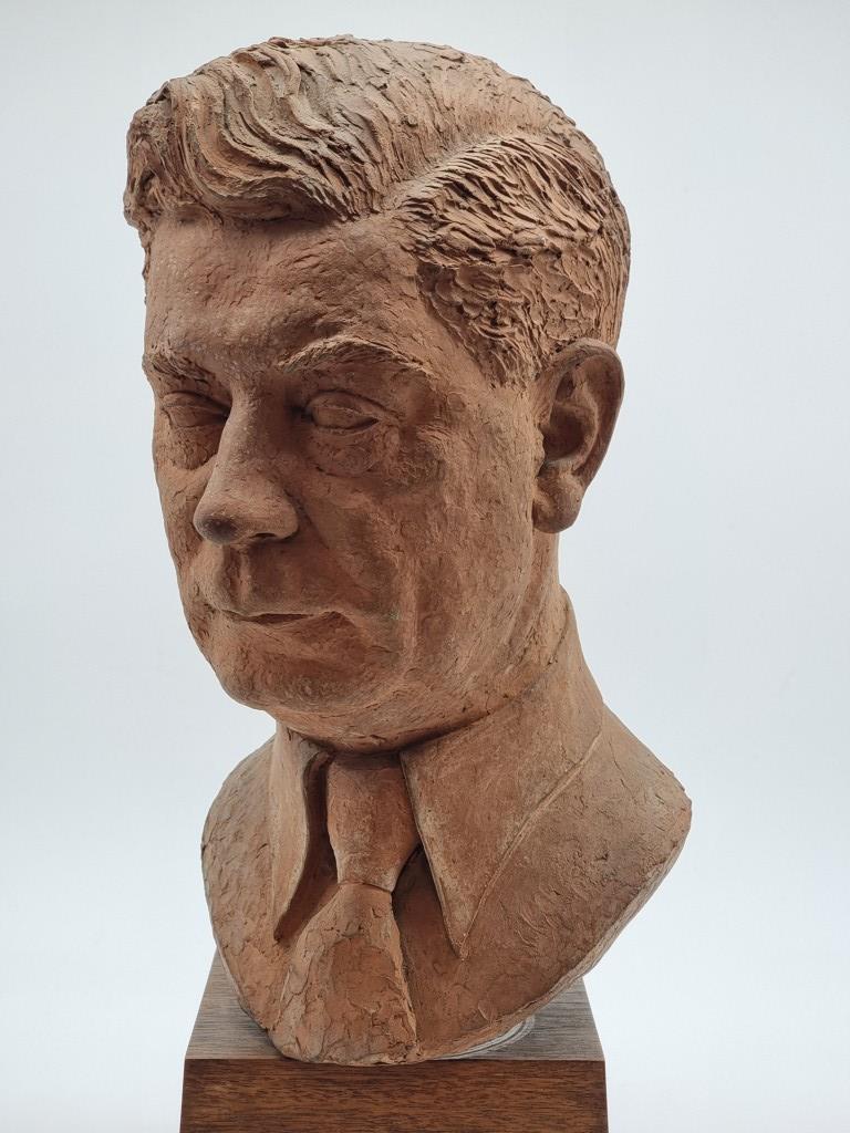 Freda Skinner, a terracotta bust of James Esmond Randall, signed and ...