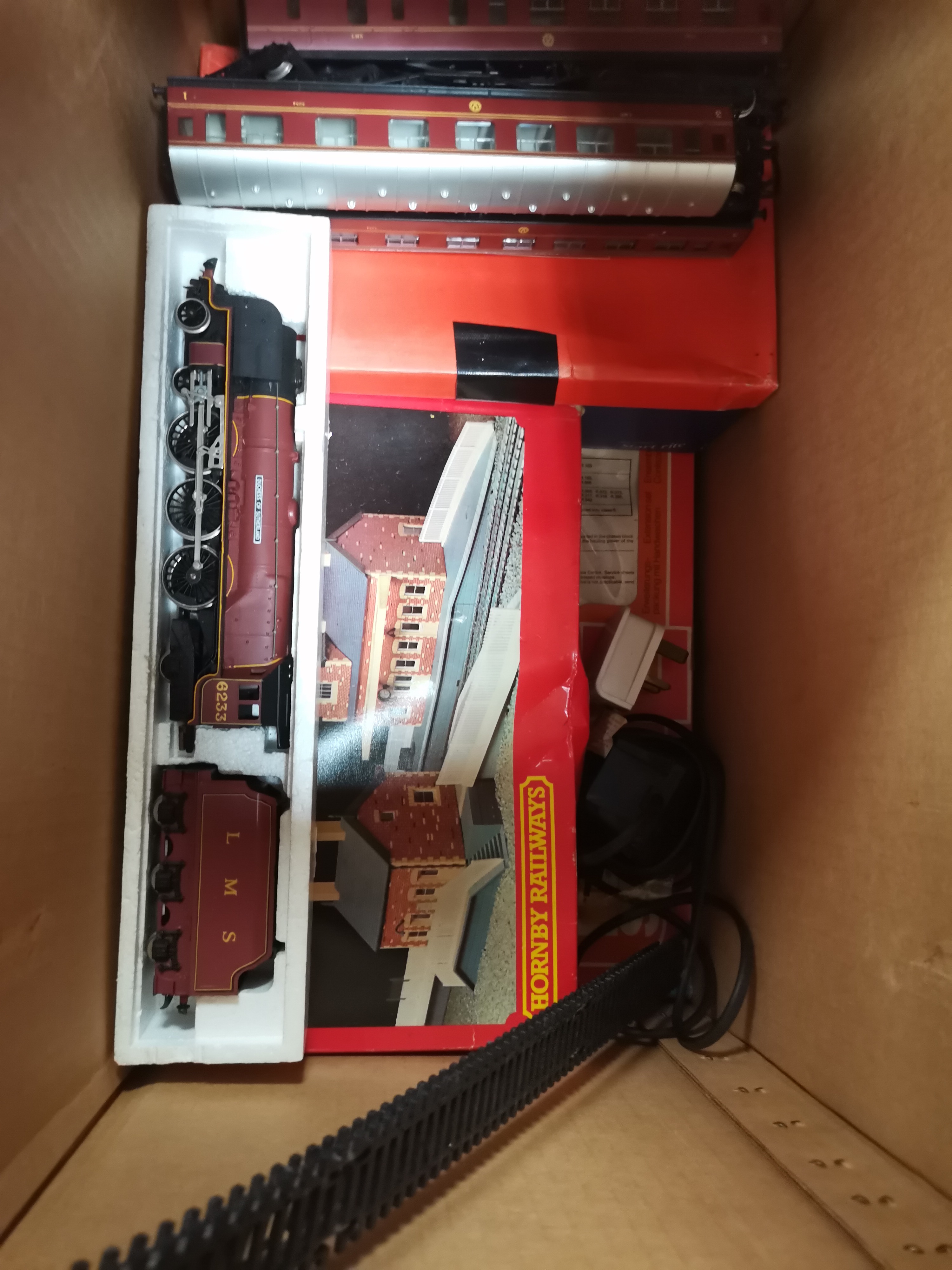 A box of trains and train tracks etc