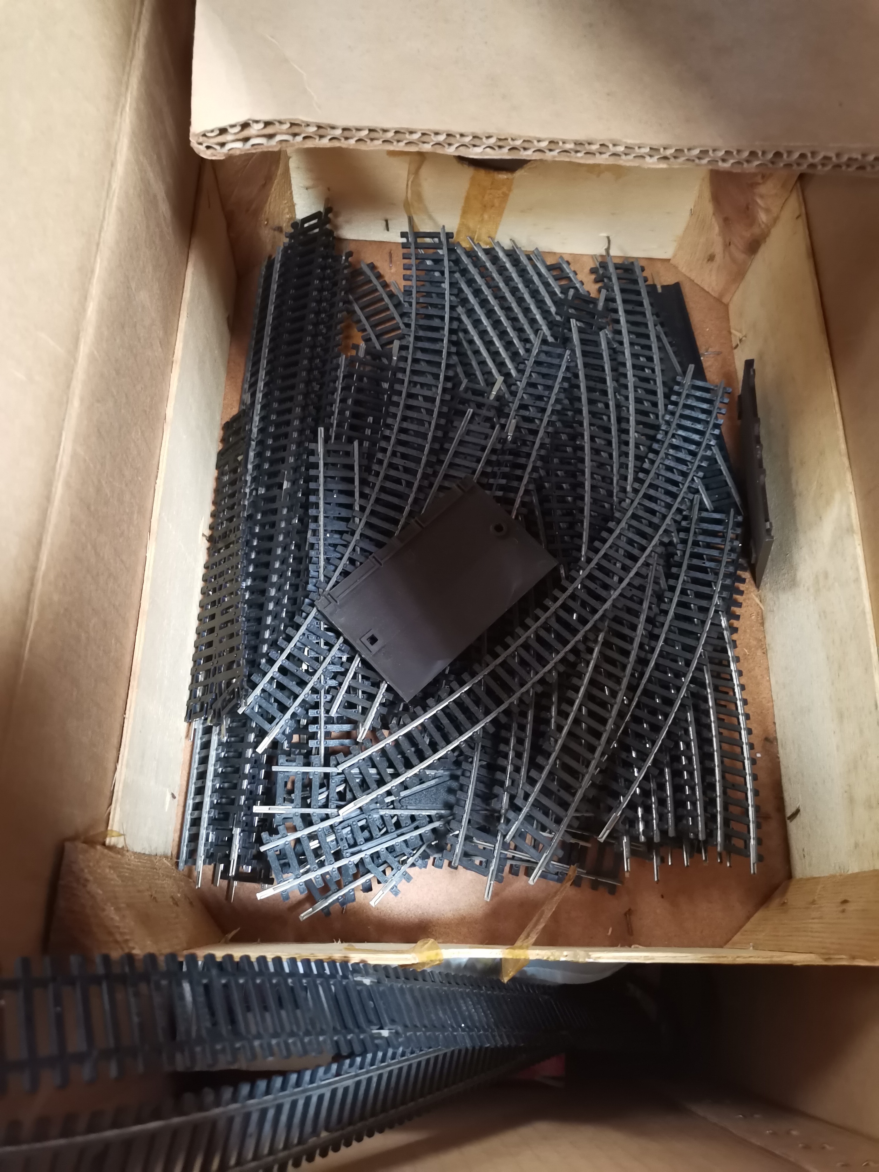 A box of trains and train tracks etc