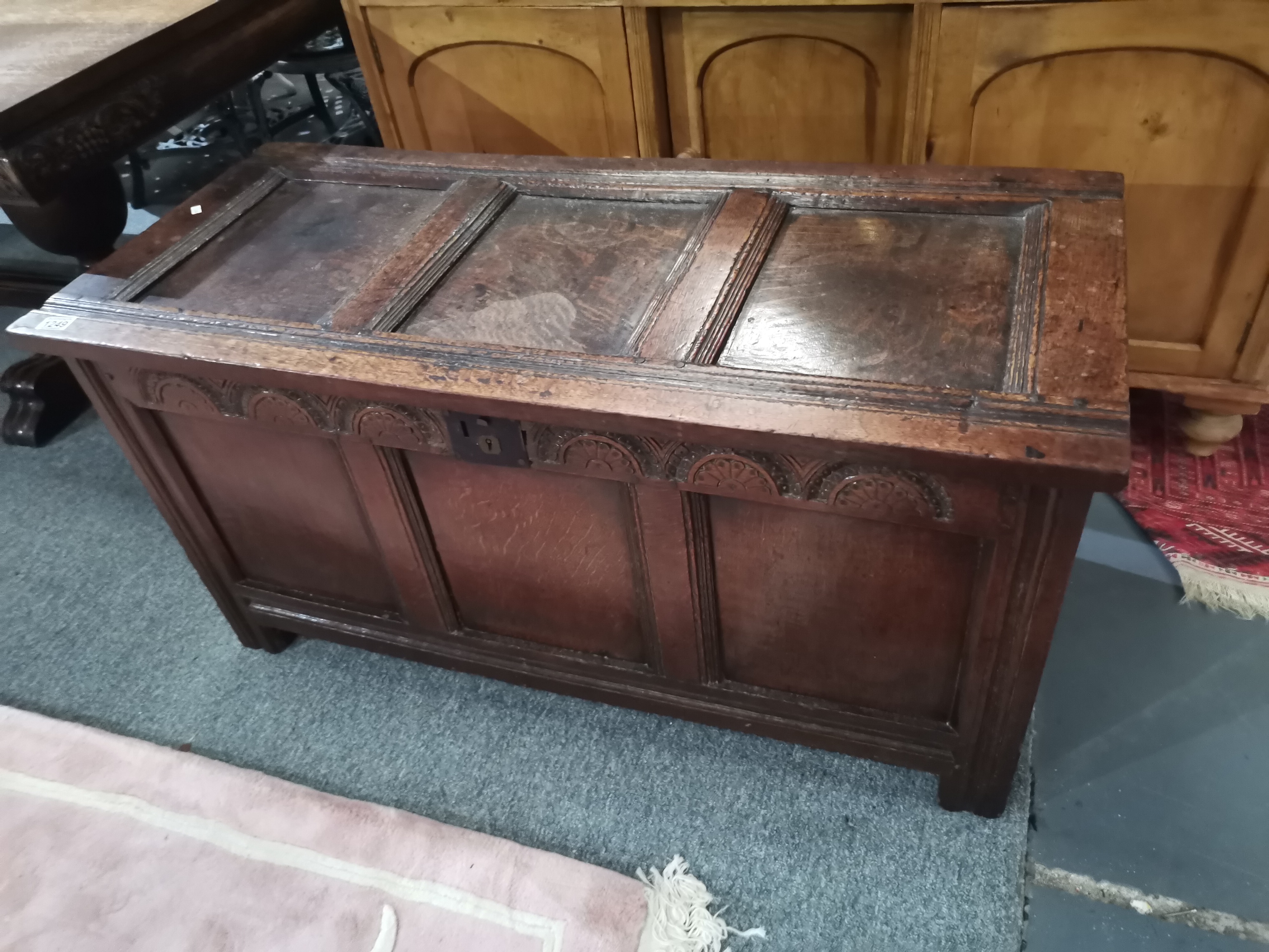 A 17TH CENTURY OAK PANELLED COFFER with arcaded carved freeze.118cm ...