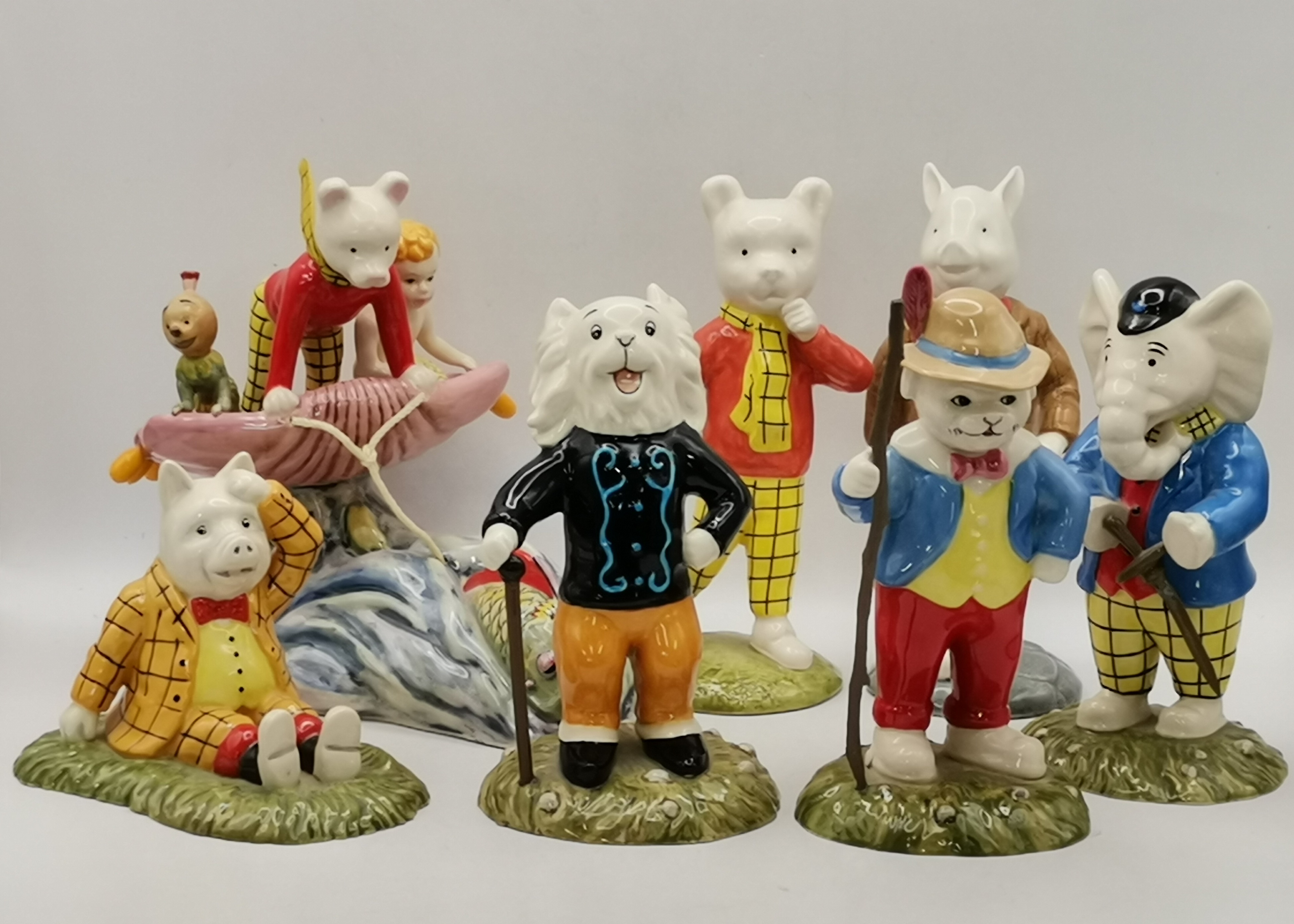 A set of Royal Doulton Rupert figurines including Algy Pug, Podgy lands ...