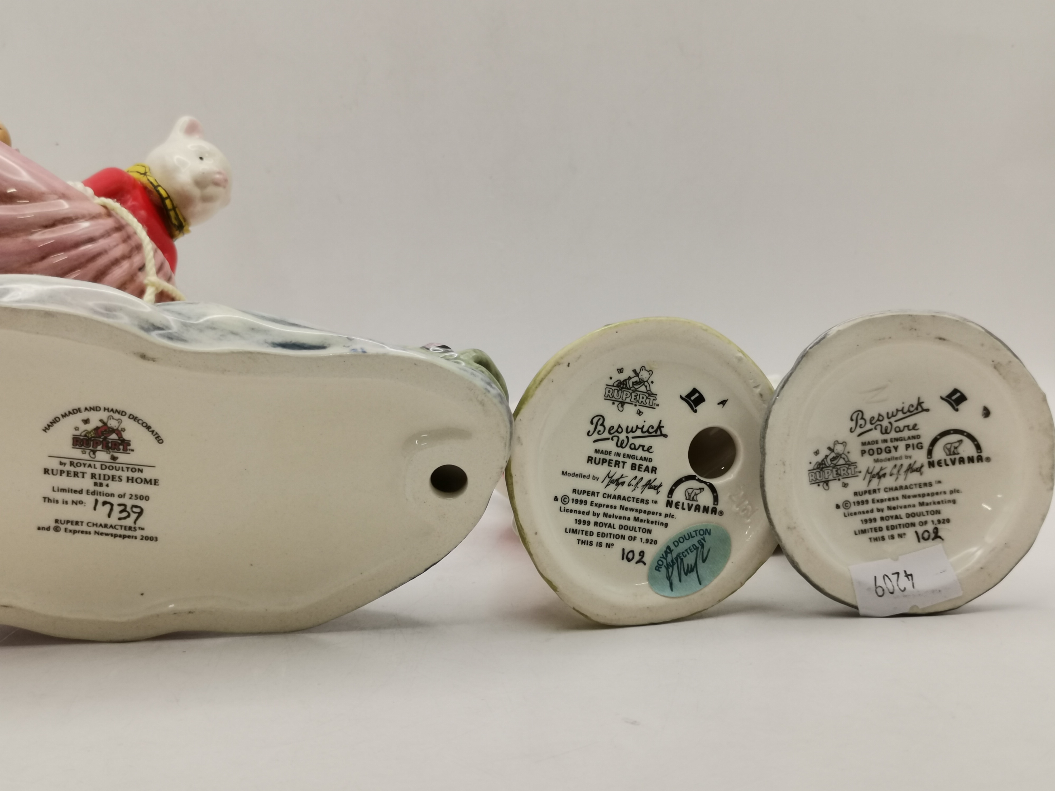 A set of Royal Doulton Rupert figurines including Algy Pug, Podgy lands ...