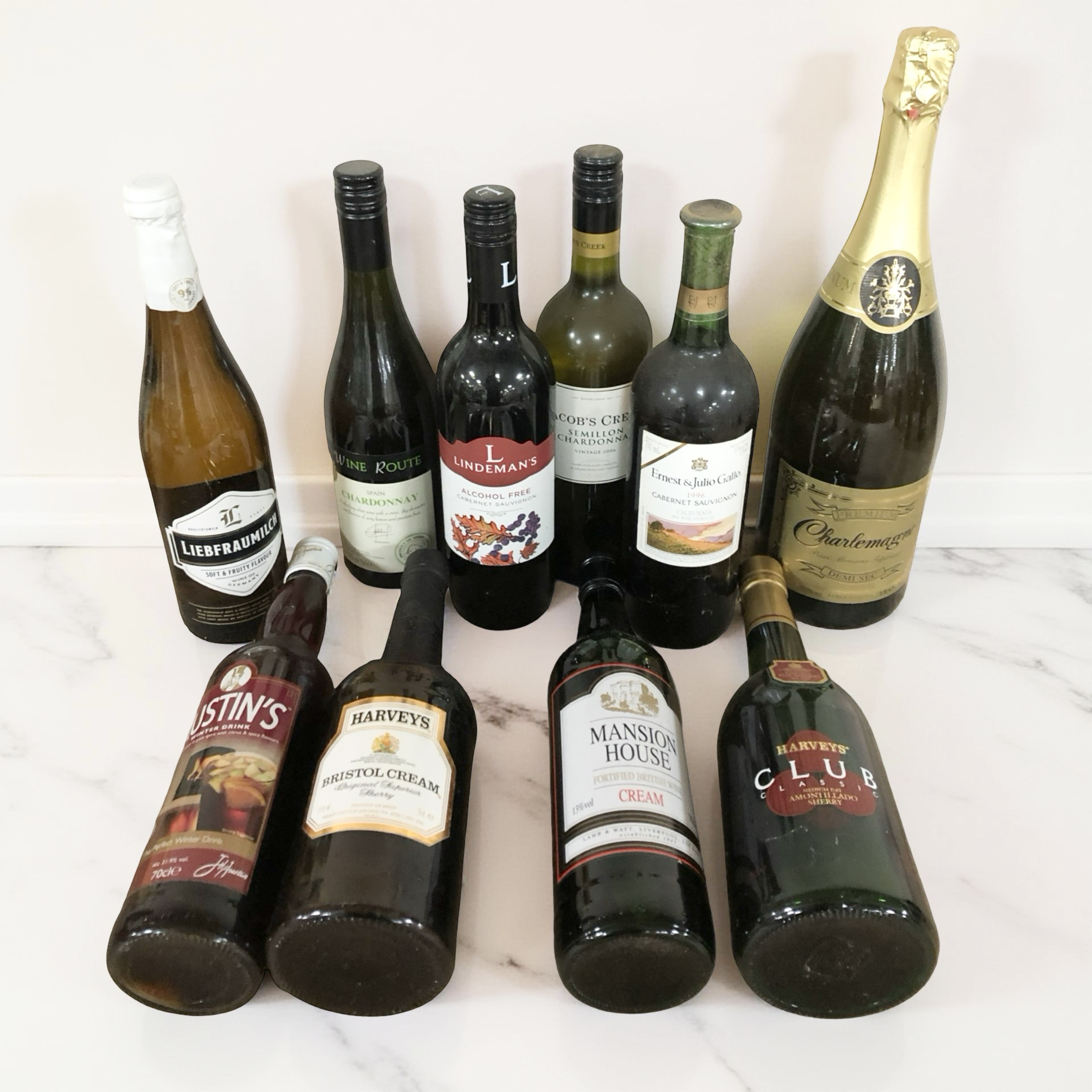Ten various bottles of alcohol including a magnum bottle of Charlemagne ...