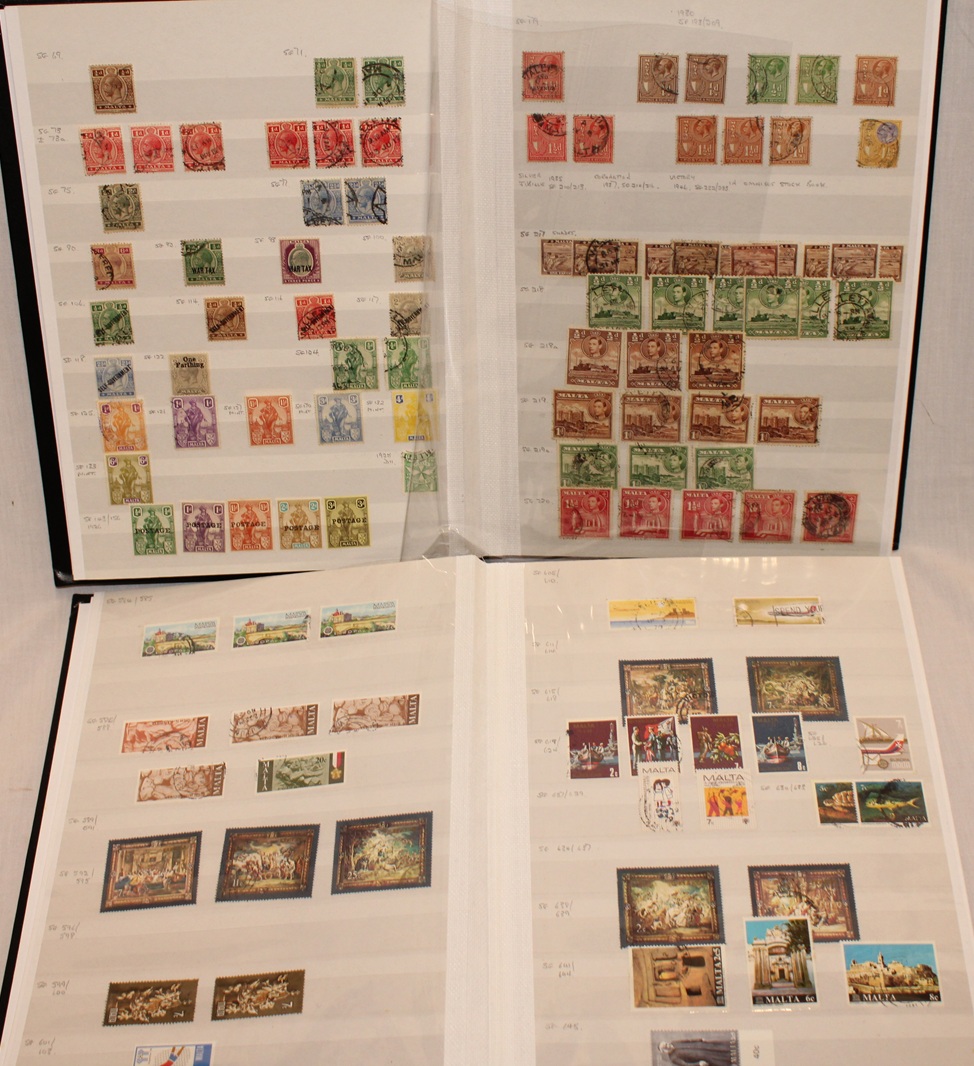 Two stock books containing a collection of Malta stamps, Victoria ...