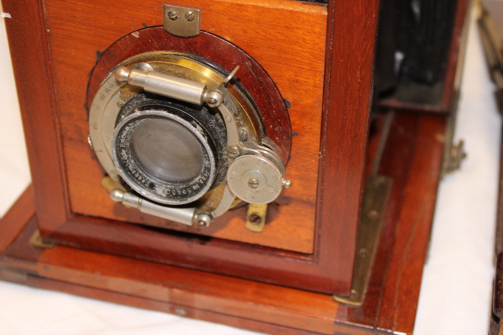 A brass mounted mahogany folding plate camera "The Loidis" by Pearson ...