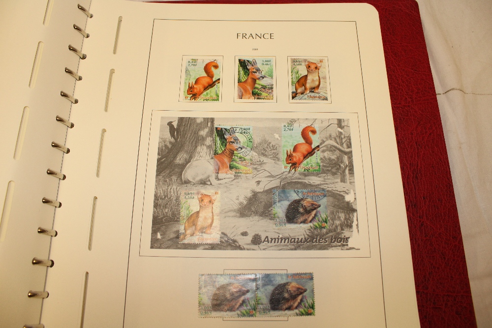 A printed folder album containing a collection of France stamps 1990-2002