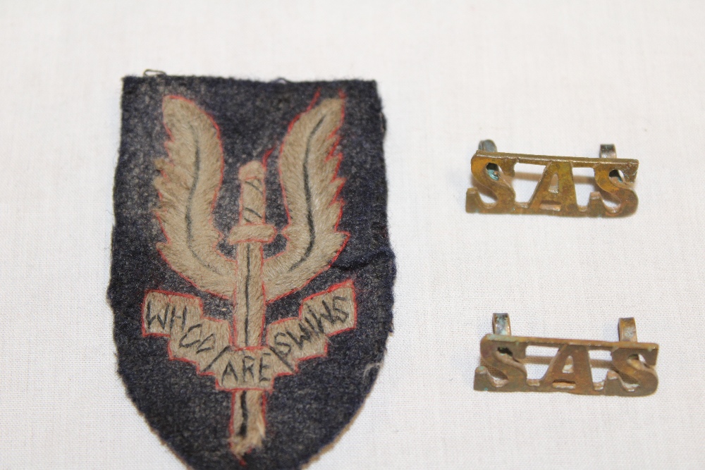 A Second War Middle East made SAS cloth cap badge and pair of brass SAS ...