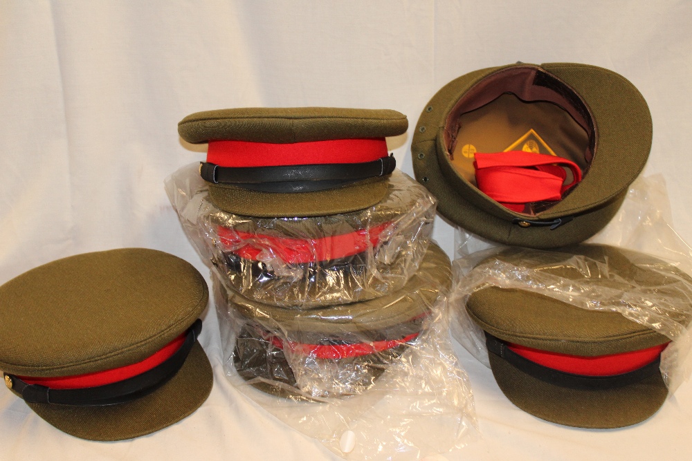 Six modern unissued military khaki peaked caps