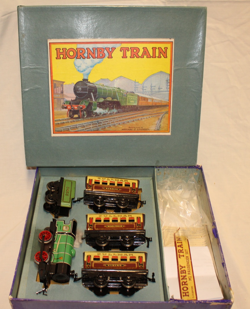 A Hornby 00 gauge clockwork tank locomotive and tender and three ...