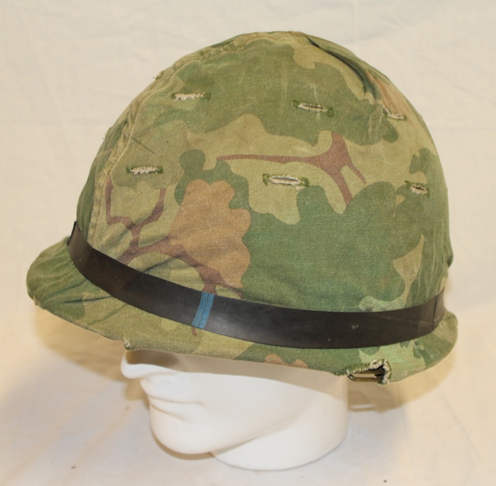 A Vietnam War era US Marine's M1 helmet with liner and combat cover ...