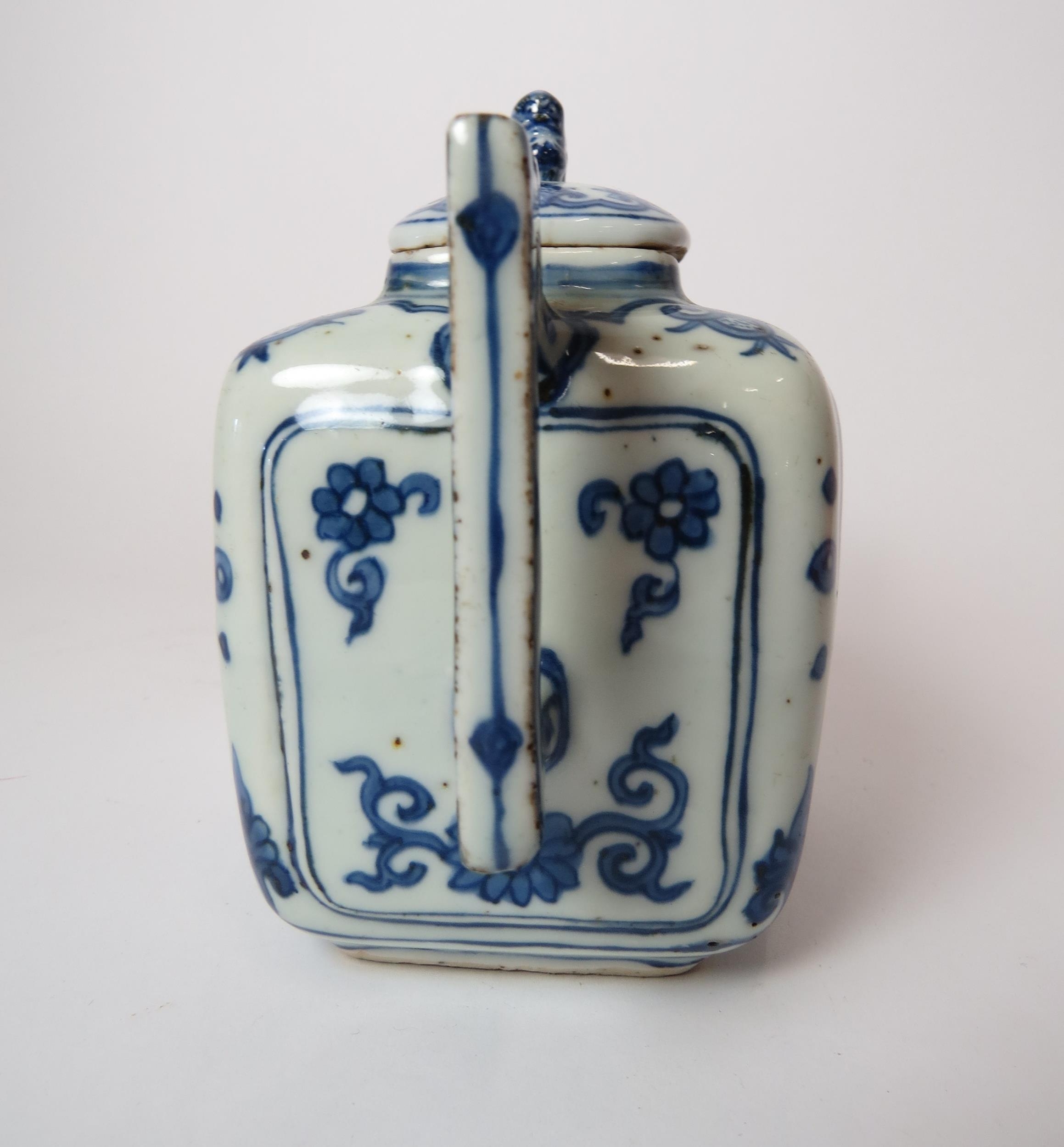 A Chinese blue and white wine pot decorated with dog of fo and ball ...