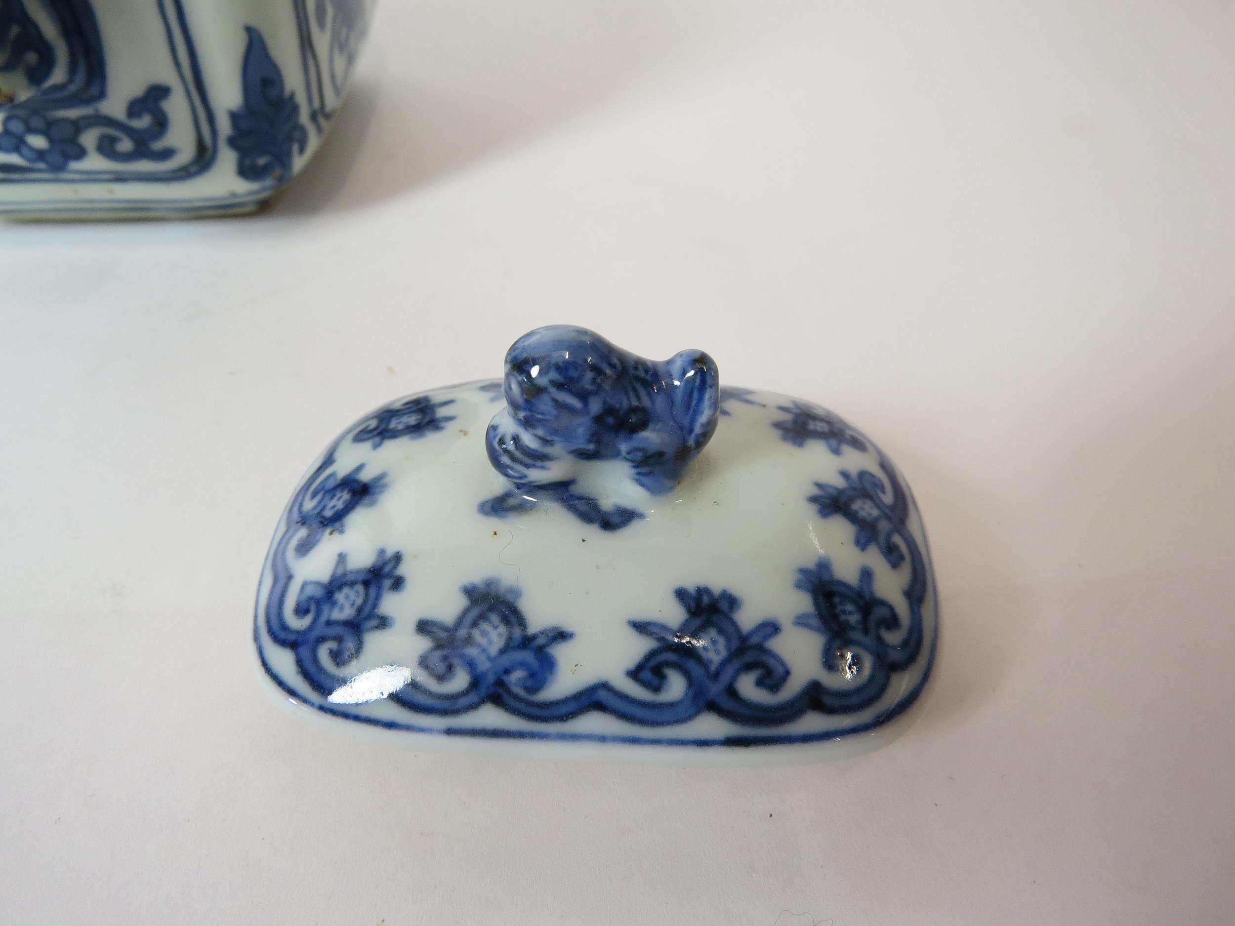 A Chinese blue and white wine pot decorated with dog of fo and ball ...