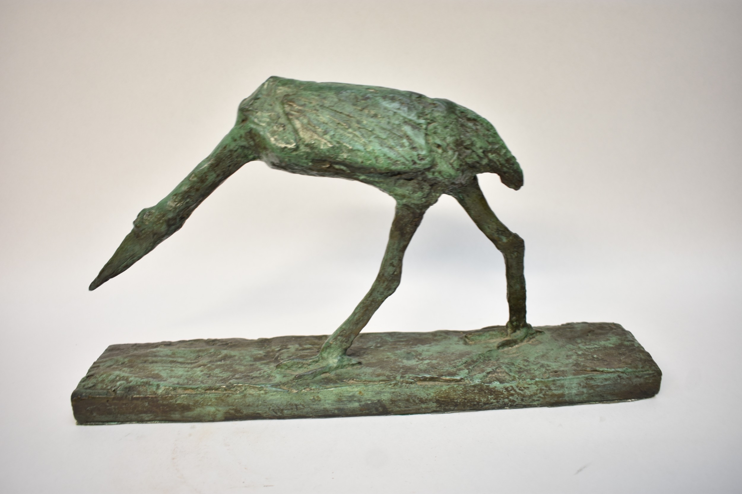A bronze eagle figure and a bronze stork (2)