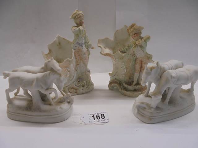 Four early bisque figures.