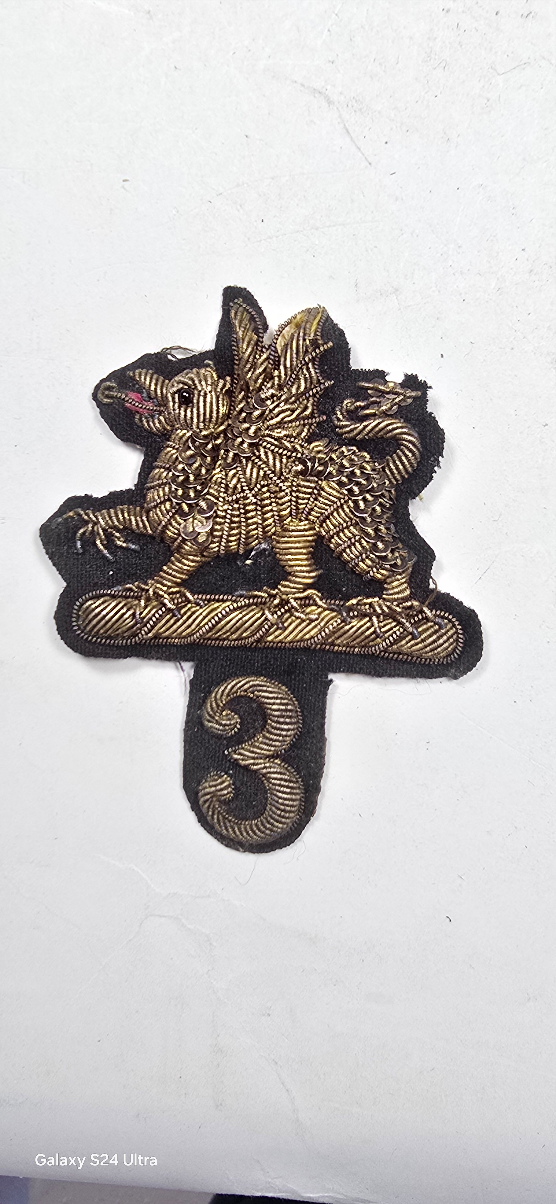 3rd (East Kent) Regiment (The Buffs). An officer’s forage cap badge in ...