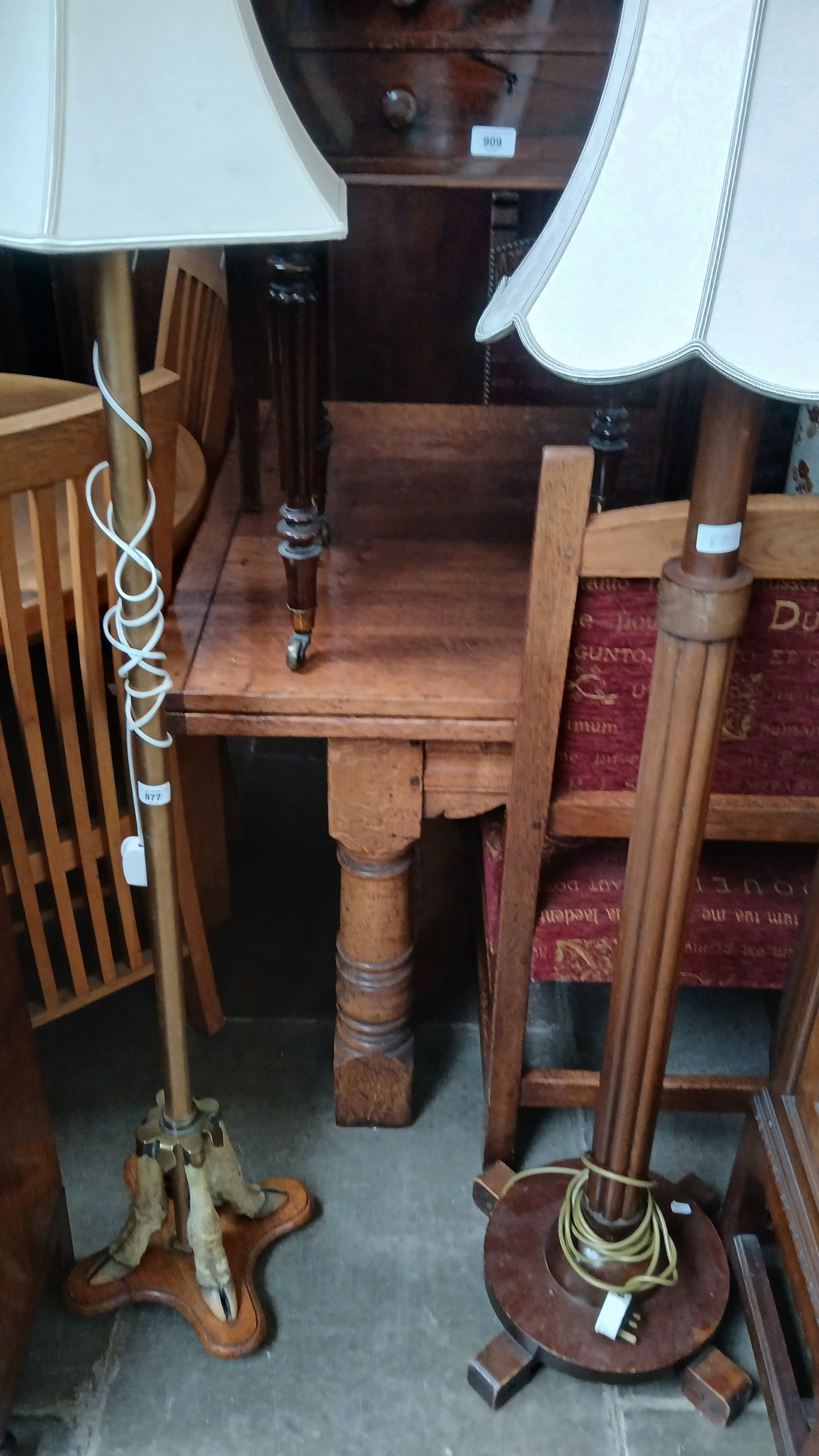 A hoof and brass standard lamp and another.