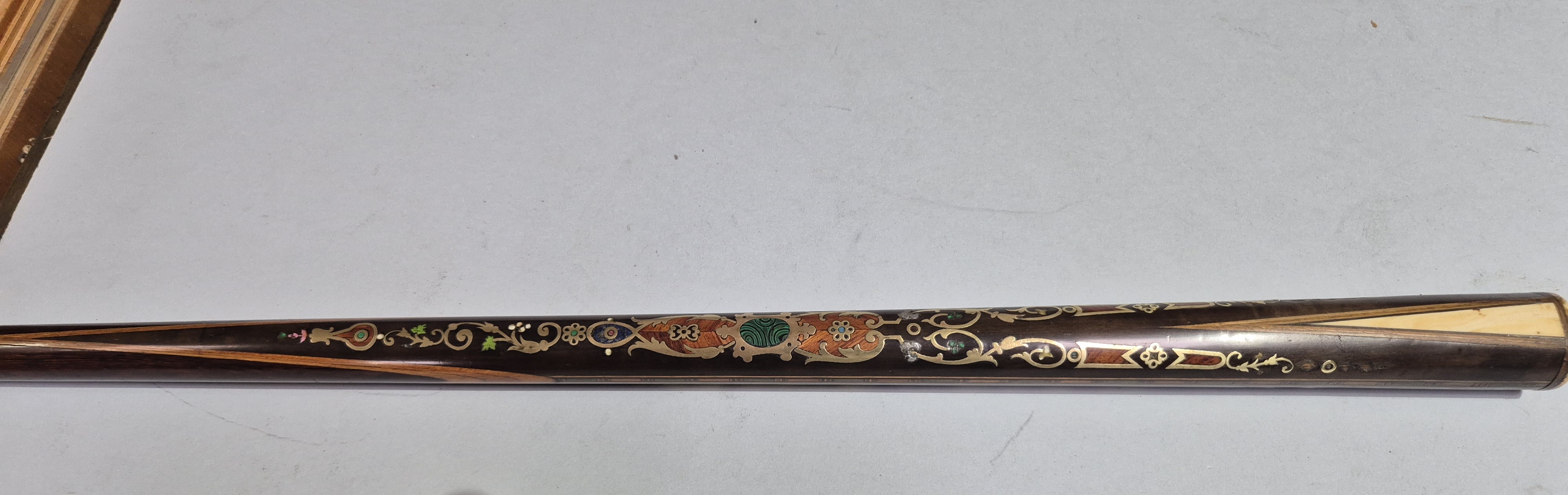 A marquetry inlaid billiard cue, inlaid with yellow metal, various gem ...