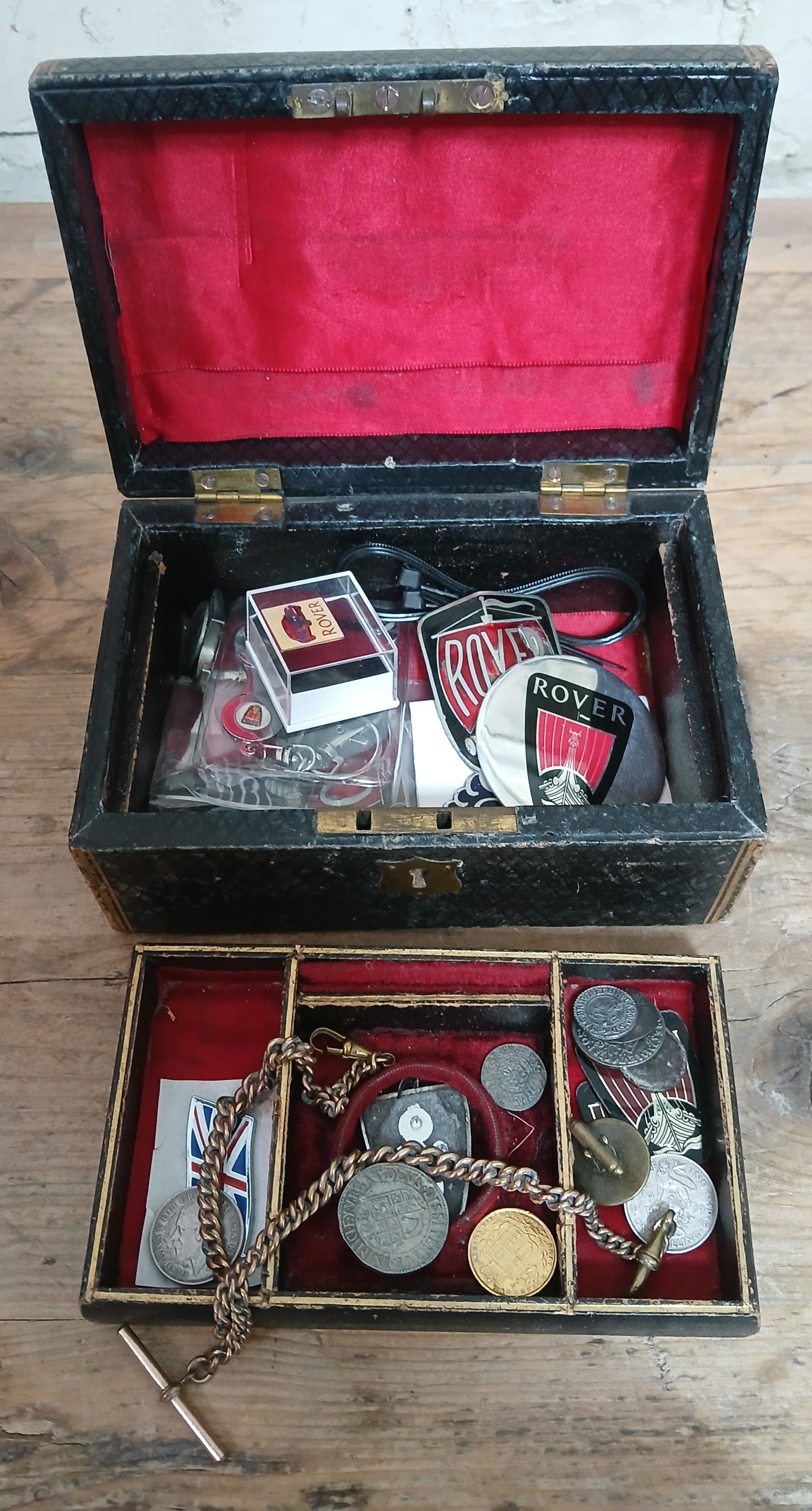 A leather jewellery box including a gold plated Albert chain ...