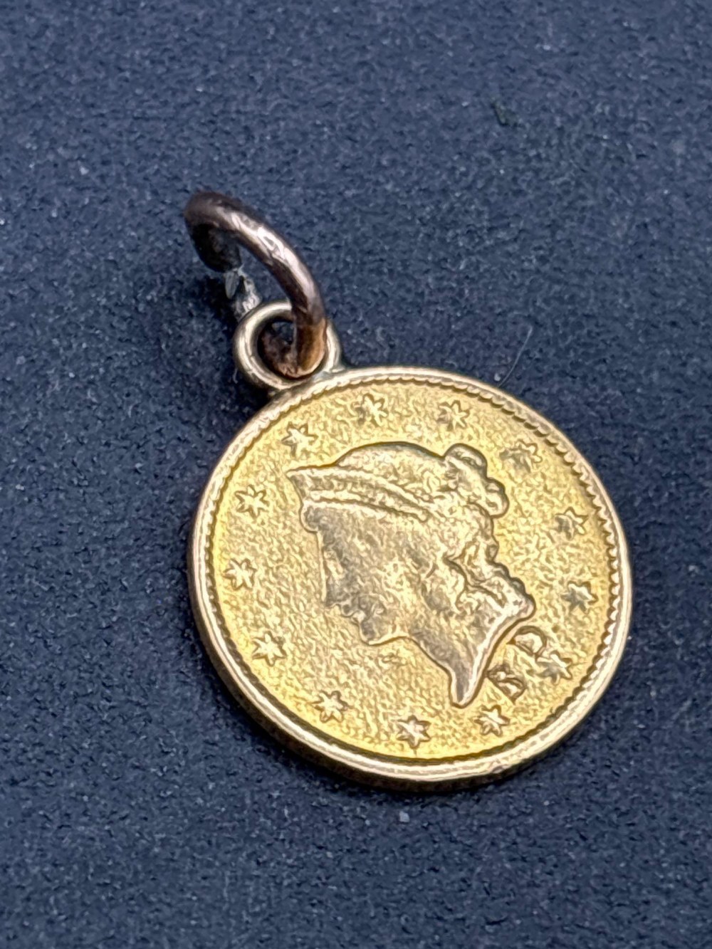 A gold 1853 dollar coin 22ct gold on 9ct jump ring 1.6 g inc.