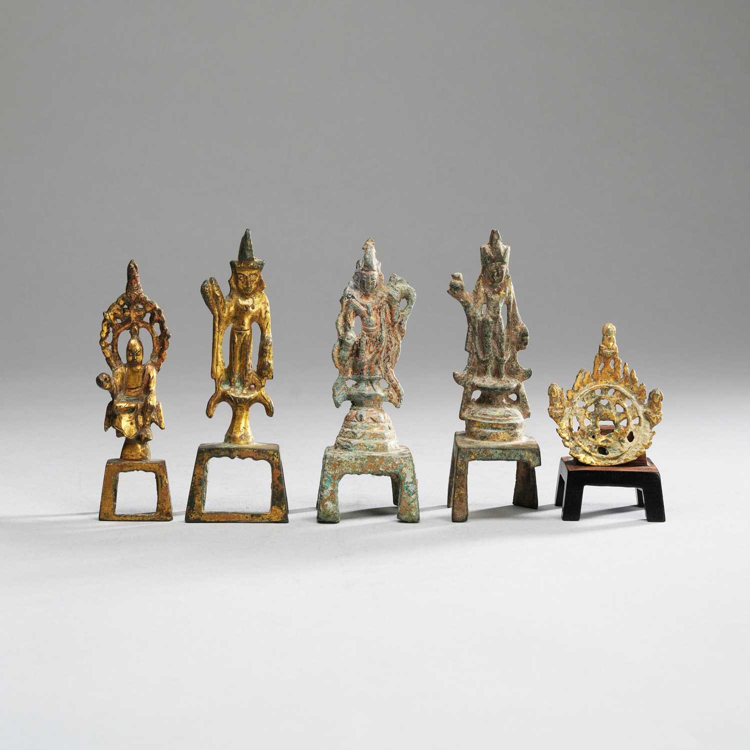 FOUR CHINESE GILT-BRONZE FIGURES TANG DYNASTY With a wood stand and a ...