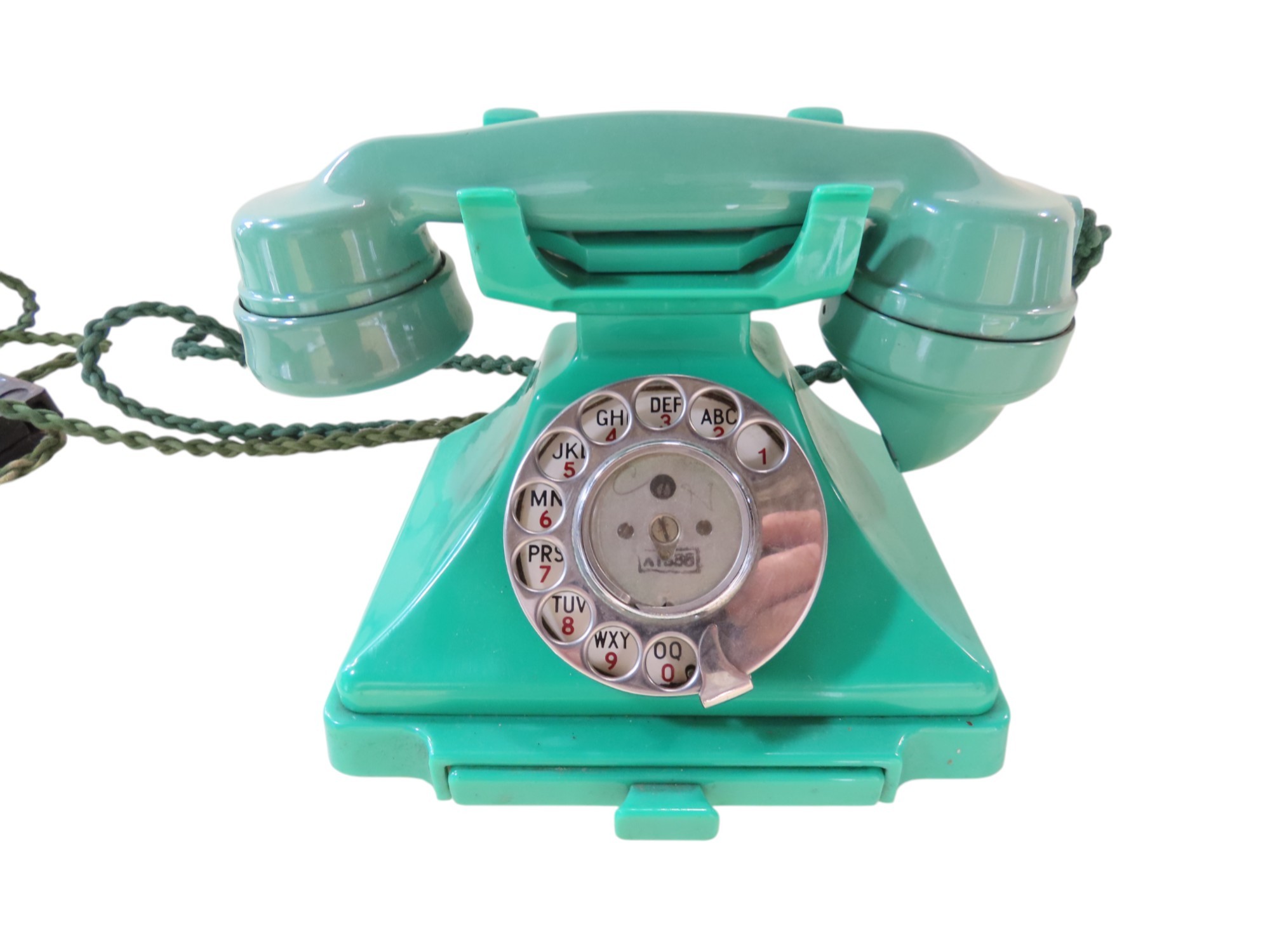 A vintage bright green Bakelite telephone set, numbered to underside "1 ...