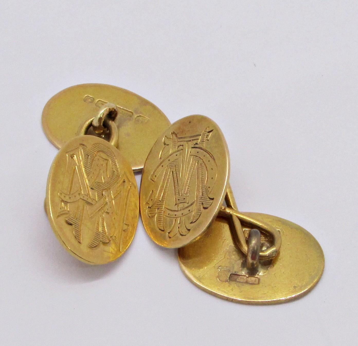 A pair of Victorian yellow gold cufflinks, each oval plaque engraved ...