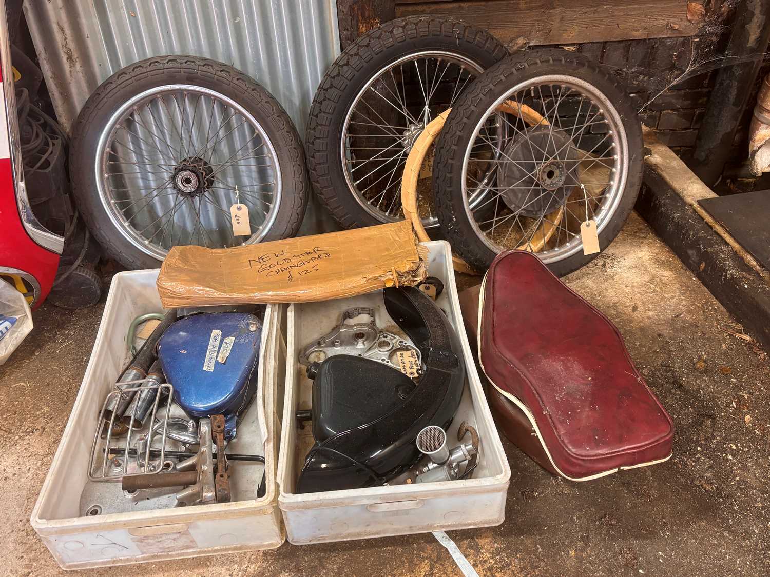 A collection of BSA motorcycle parts, comprising: a Goldstar chrome ...