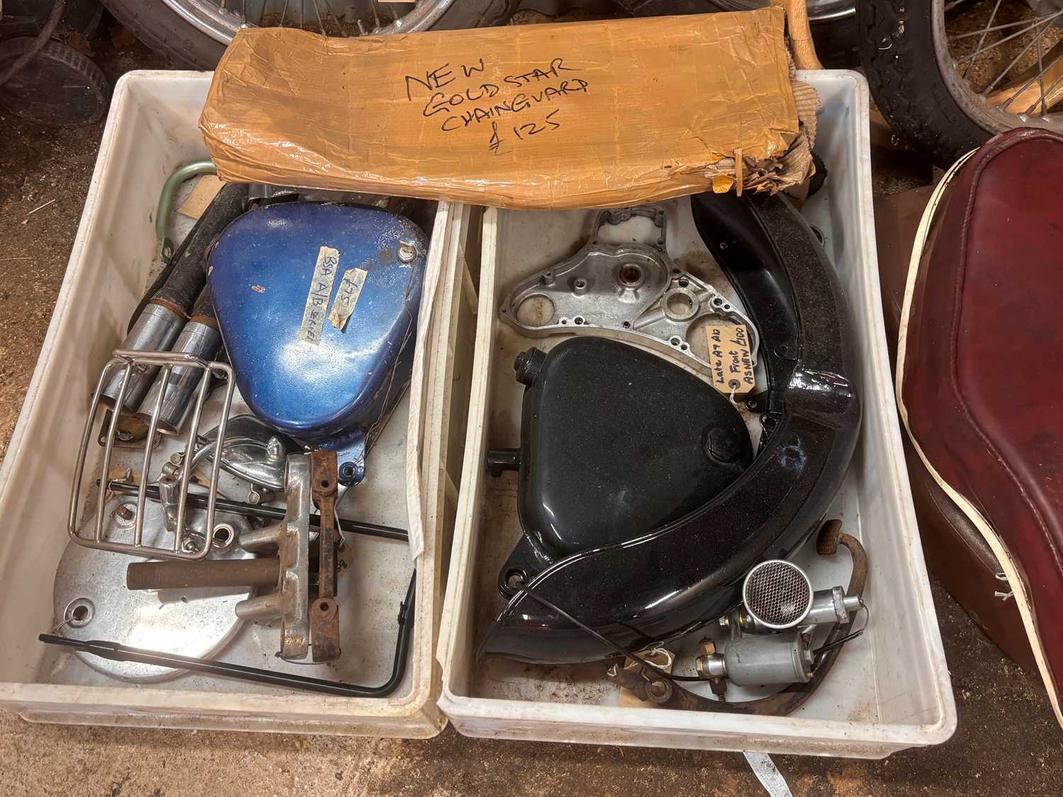 A collection of BSA motorcycle parts, comprising: a Goldstar chrome ...
