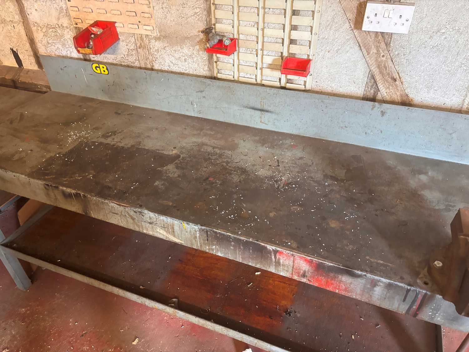 A steel workshop bench, with vice and undershelf, 198cm wide 62cm deep ...