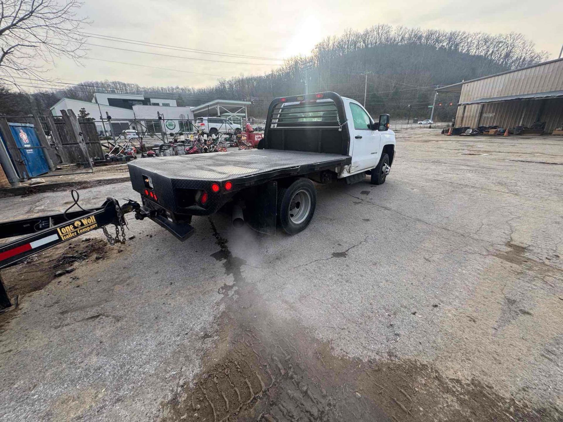 Flatbed delivery truck is a 2018 Chevrolet 3500 with 140,829 miles