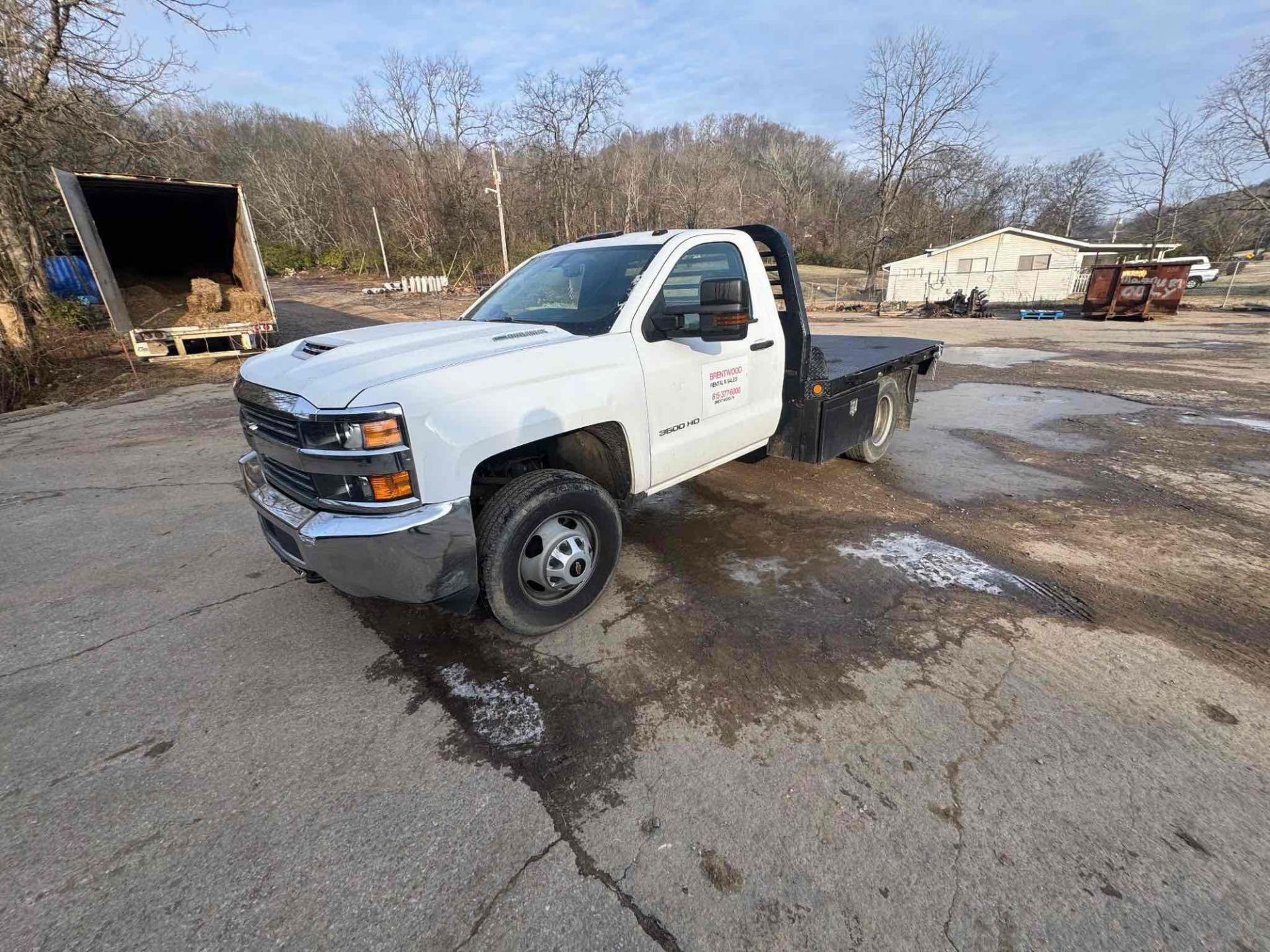 Flatbed delivery truck is a 2018 Chevrolet 3500 with 140,829 miles