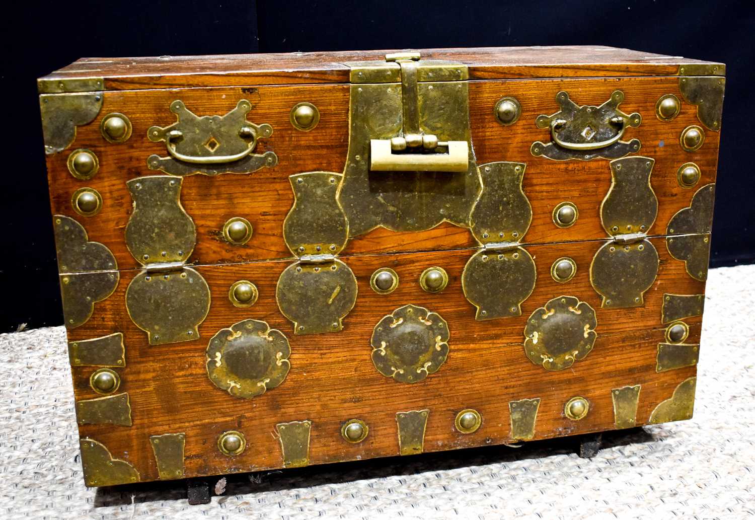 A Korean elm and brass mounted bandaji chest, with twin brass handles ...