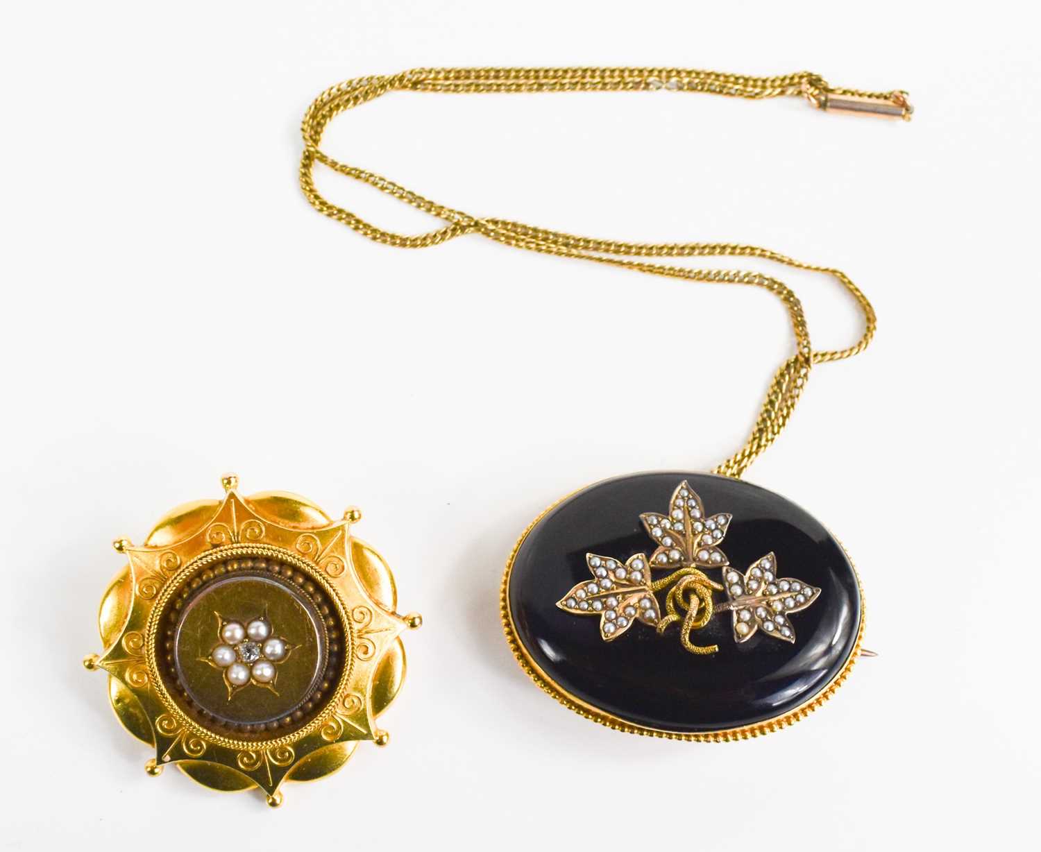 Two Victorian mourning brooches: one set with mine cut diamond bordered ...