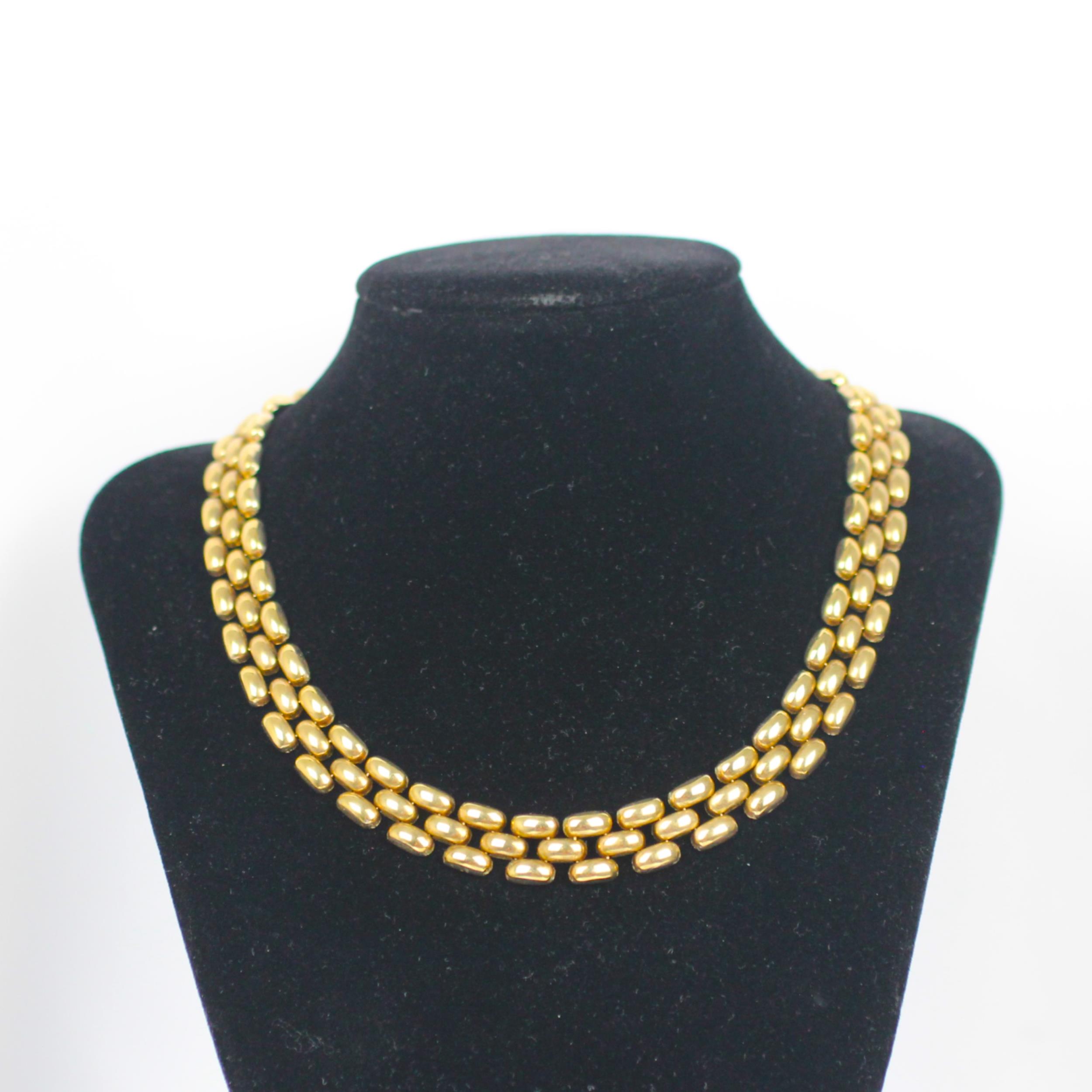 A late 20th century Italian 9ct gold collarette, the hollow stylised ...