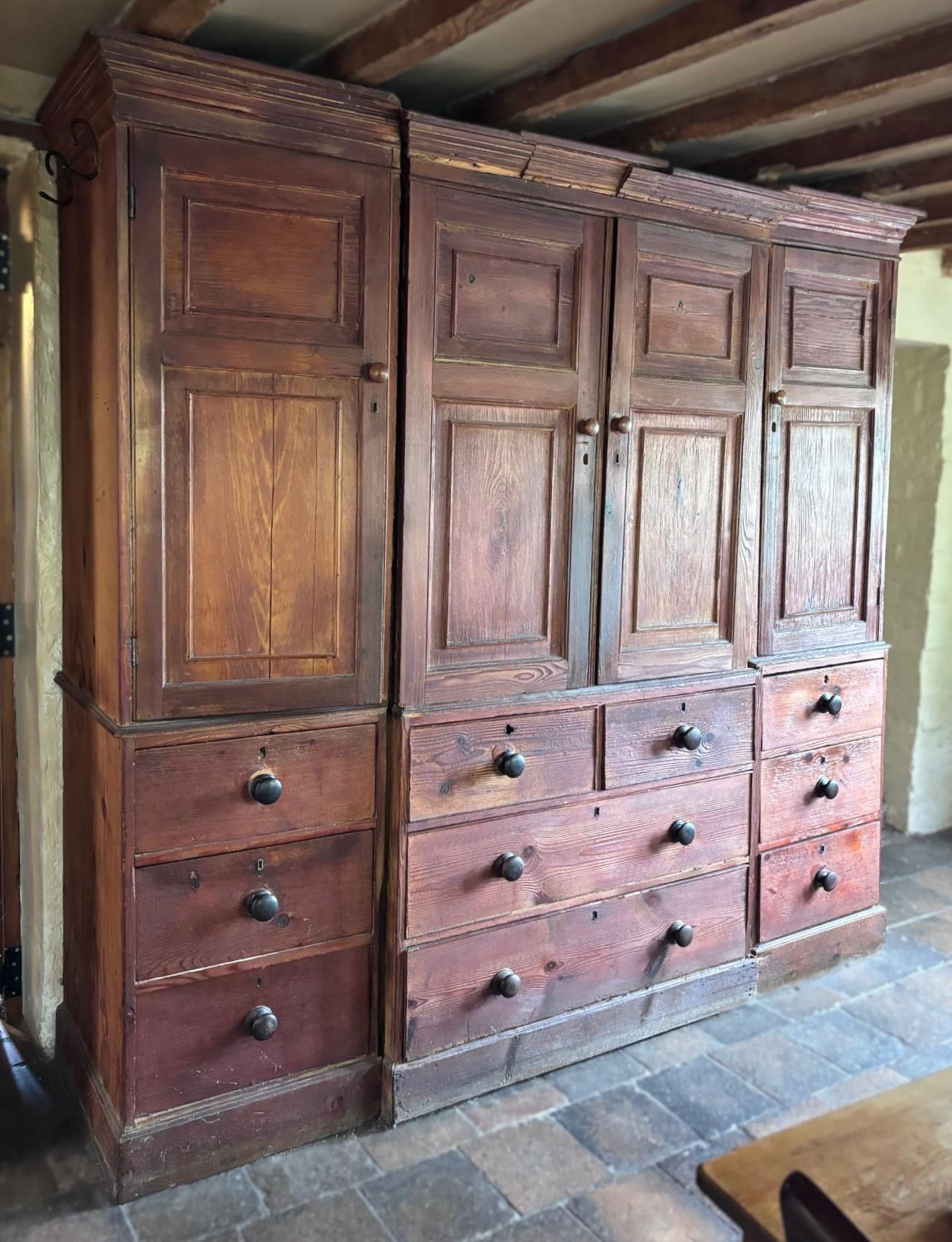 A large George III pine farmhouse housekeeper’s cupboard, the ...