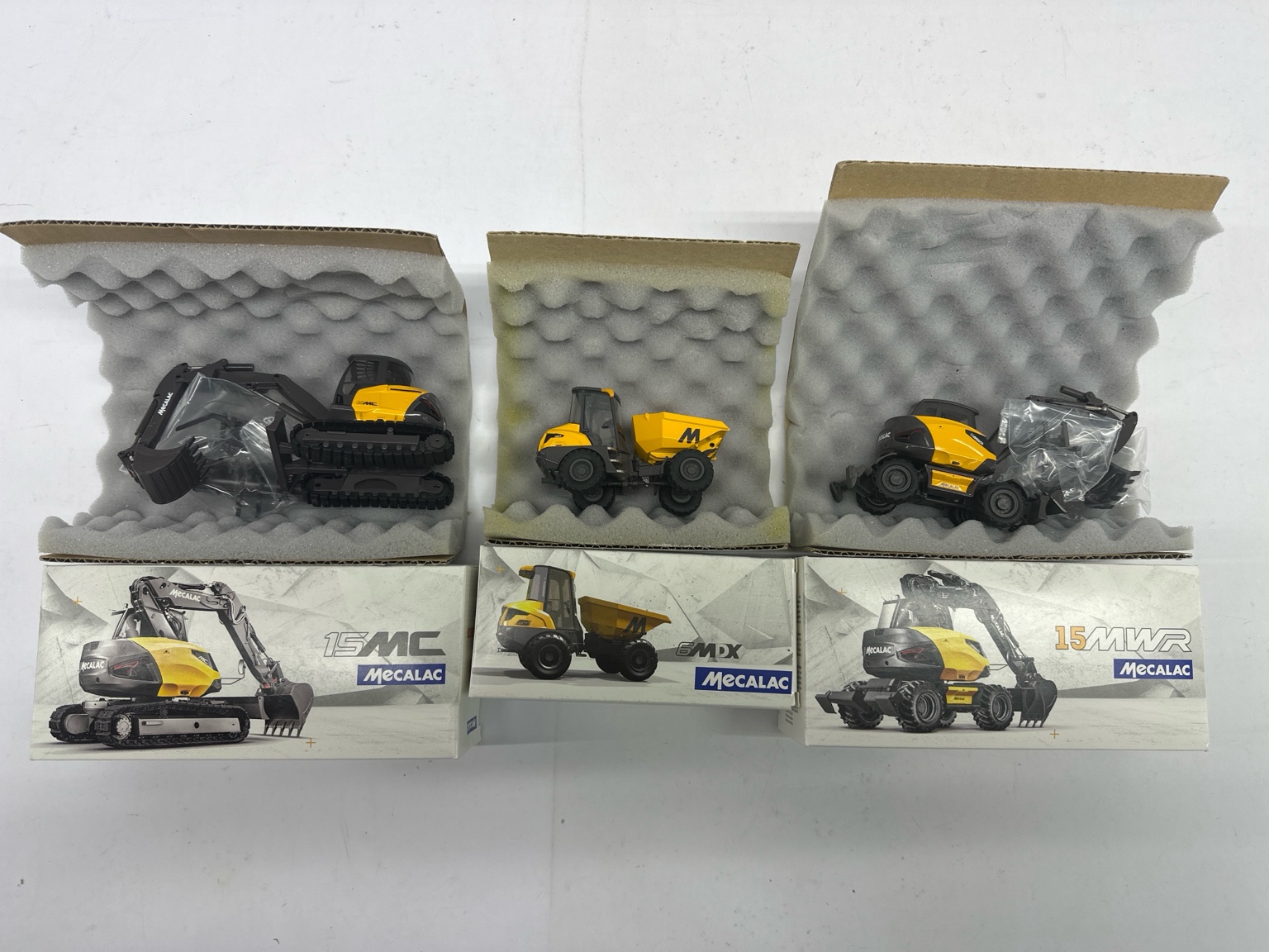 A group of Conrad 1:50 scale diecast models comprising Mecalac 15MC ...