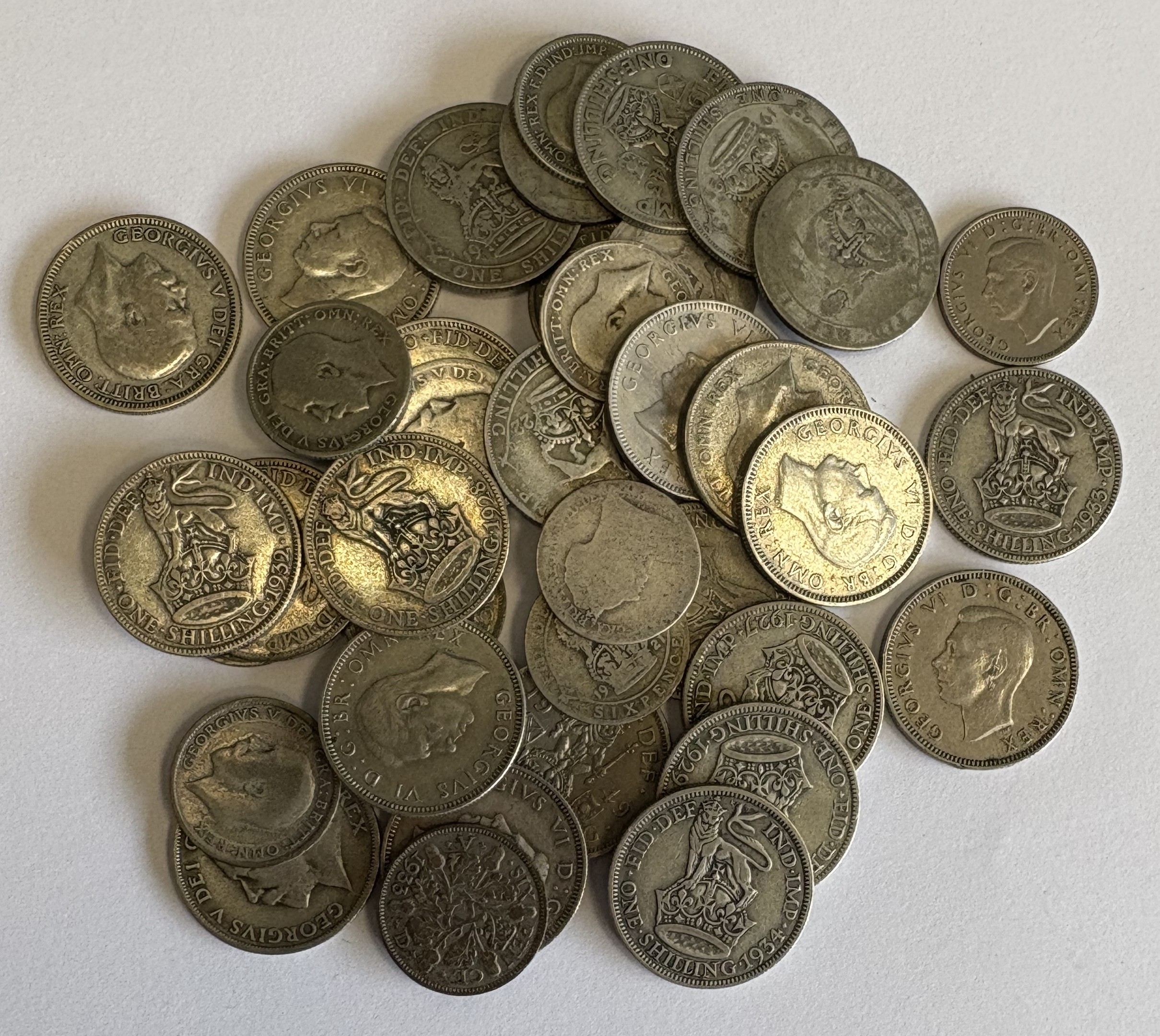 A collection of heavy silver Shilling coins. Approx. 172 grams. Est. £ ...