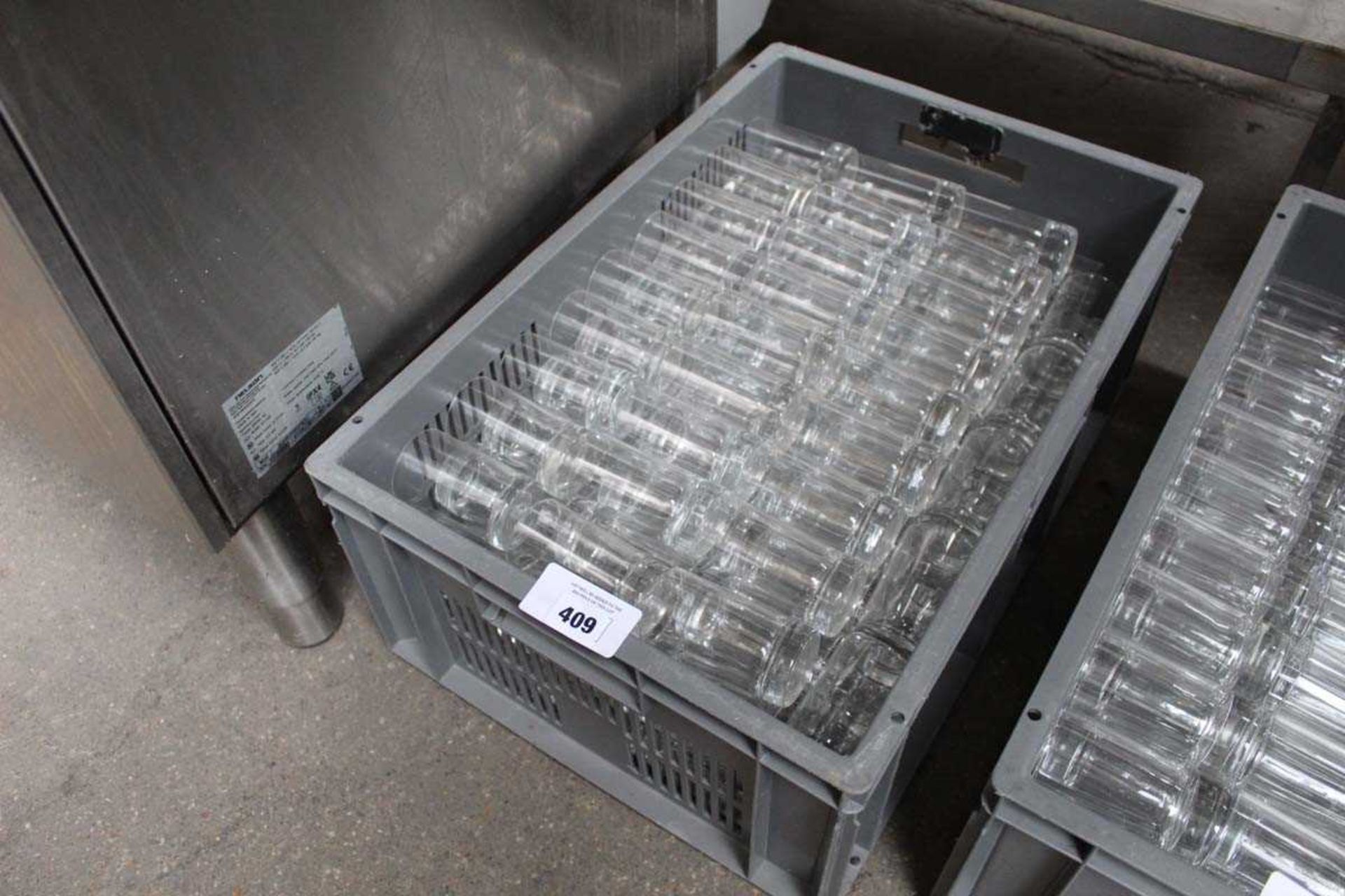 +VAT Large plastic stacking crate containing a large number of small ...