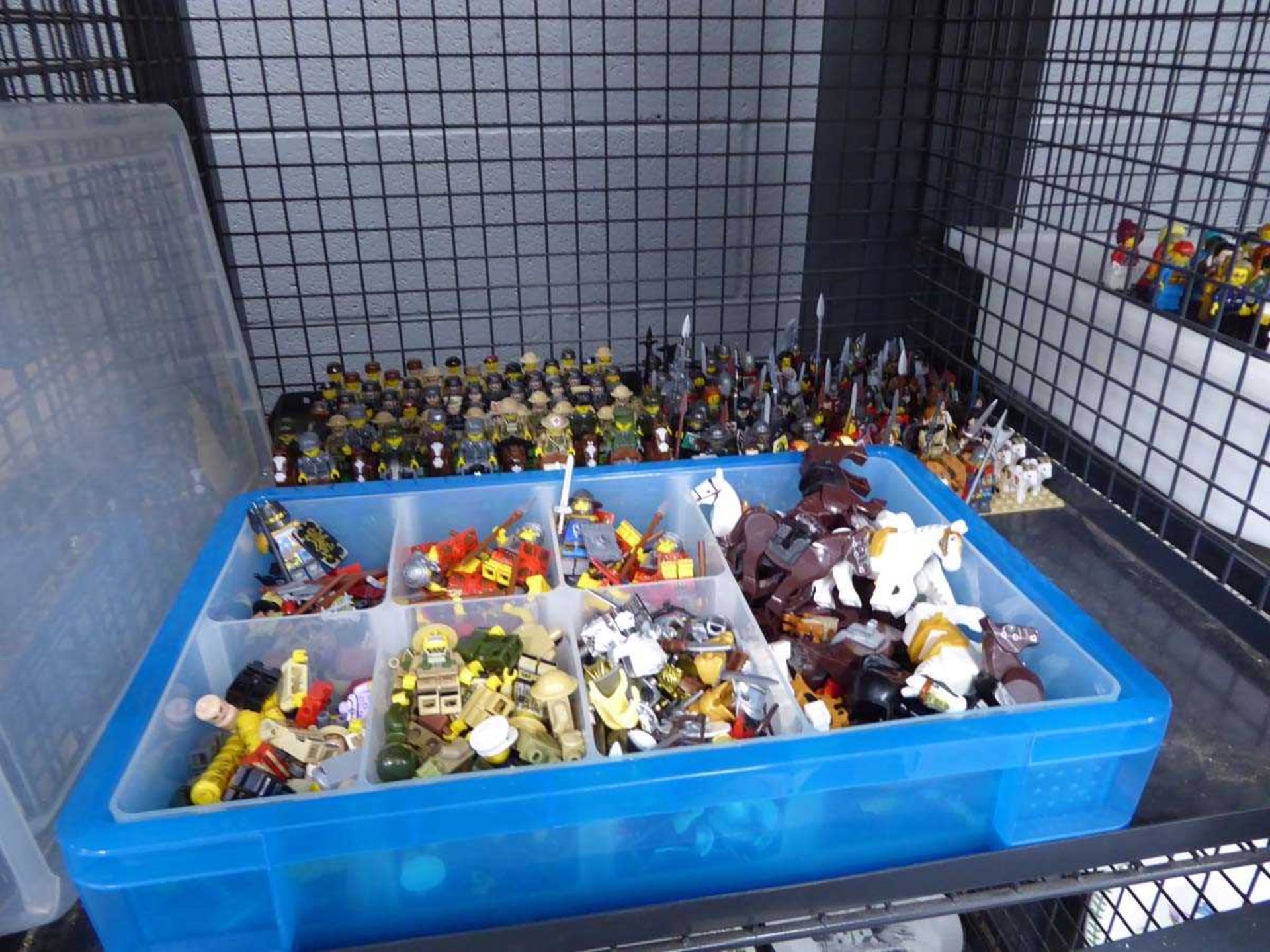 Two cages containing Lego figures