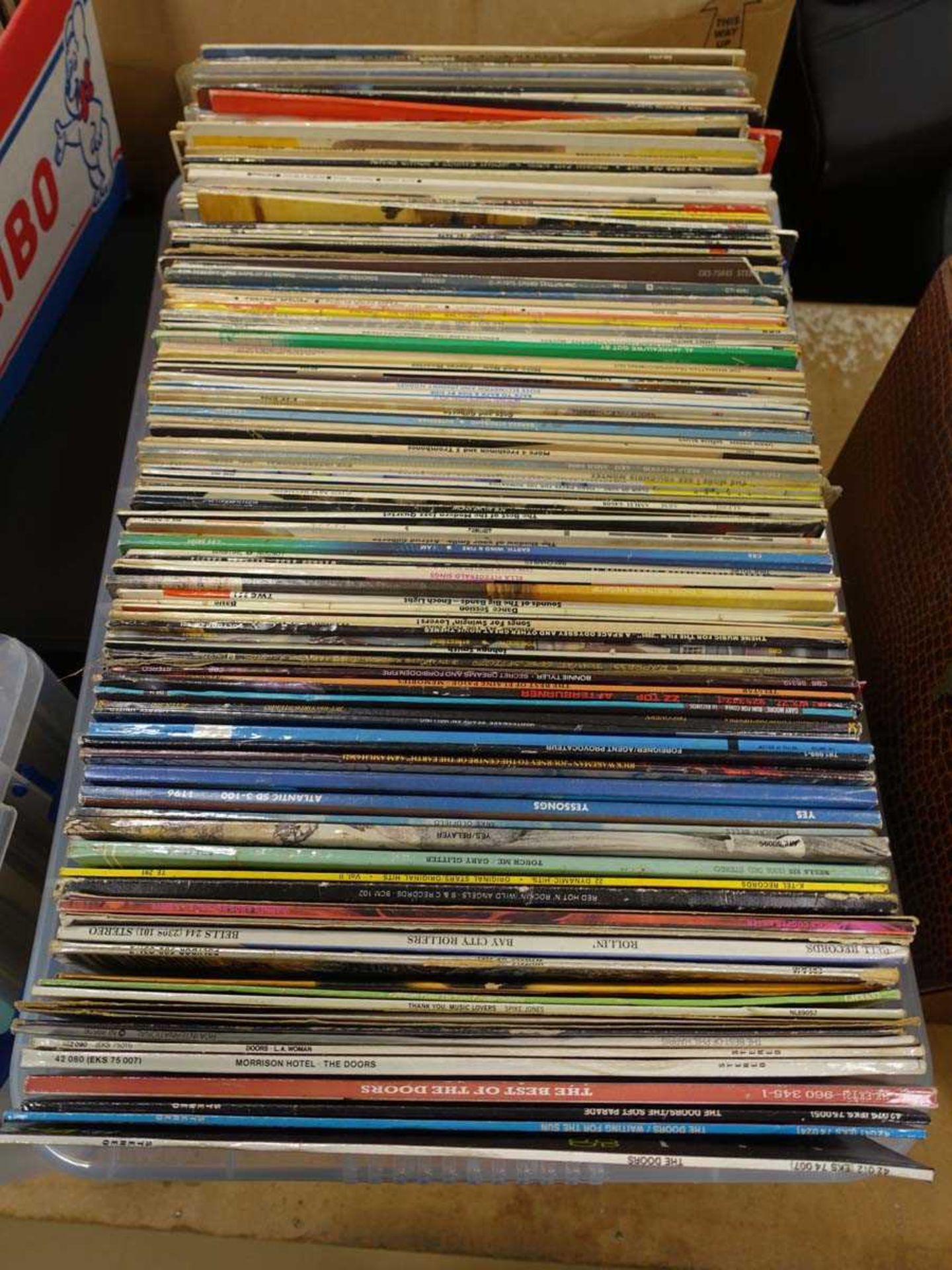 Box and case containing various vinyl records